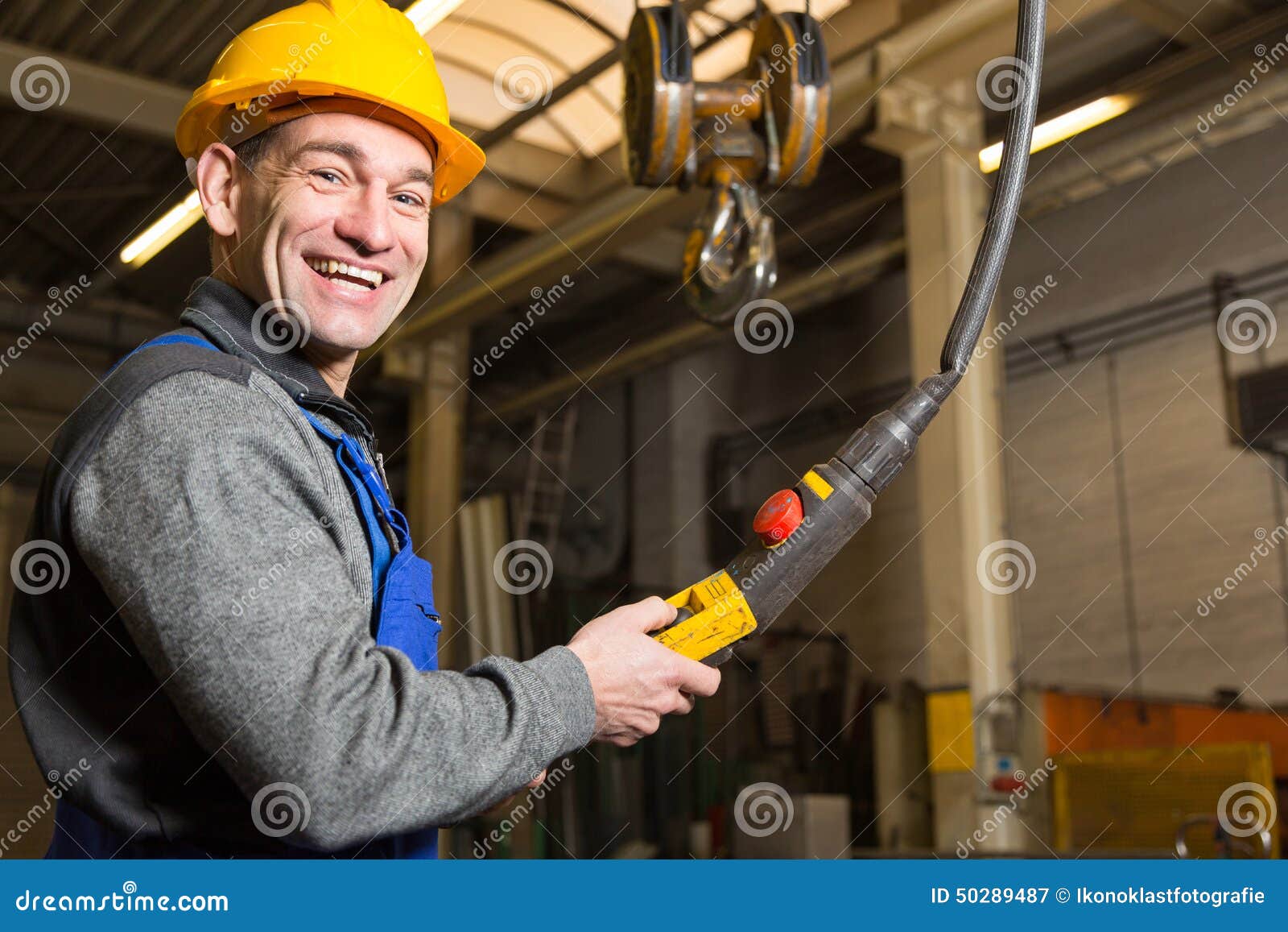 Construction Worker Operating Crane in Assembly Hall Stock Image ...