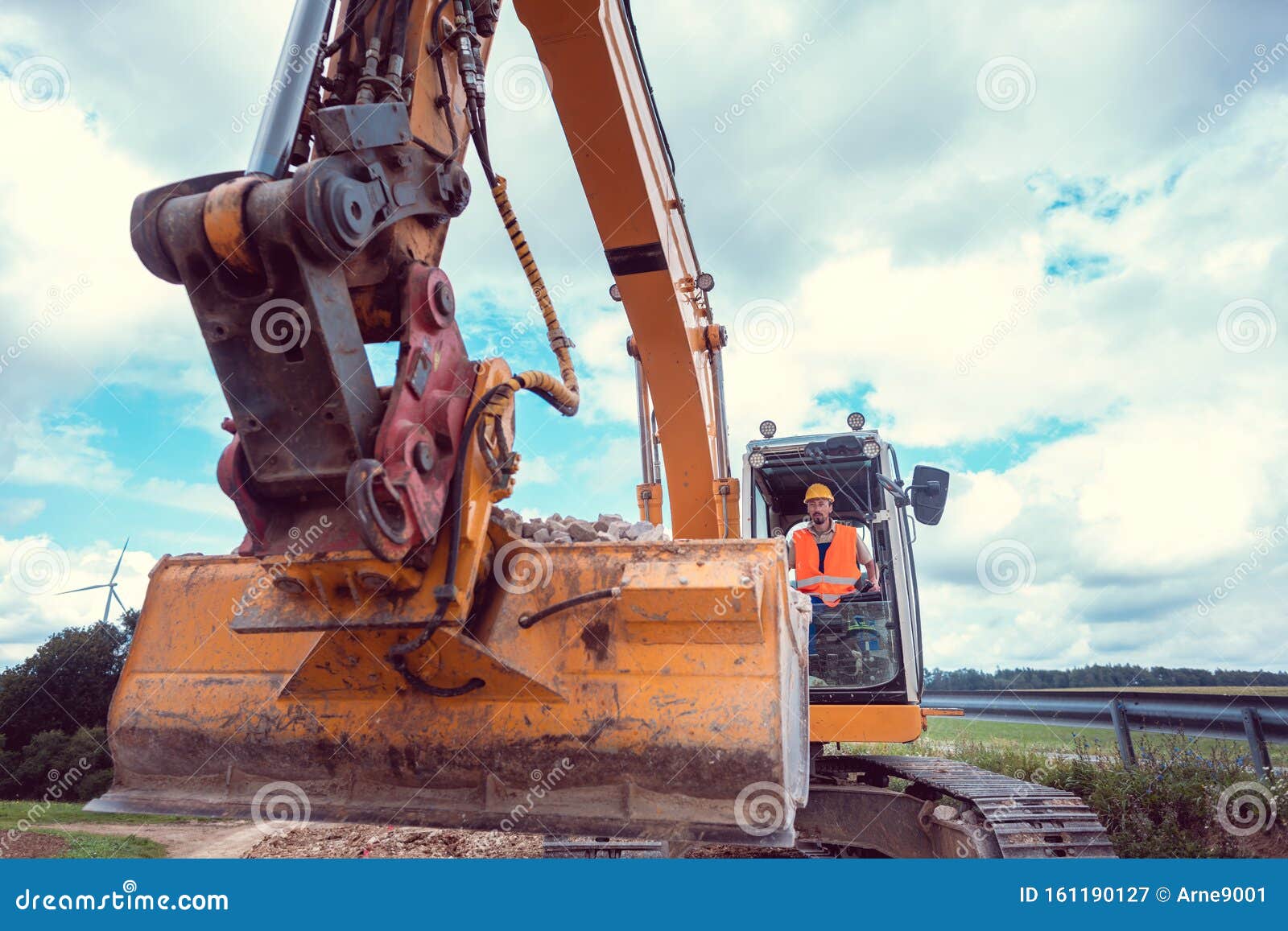 Construction Worker Operating the Crawler Excavator Stock Image - Image ... Construction Worker Operating the Crawler Excavator Stock Image - Image ...