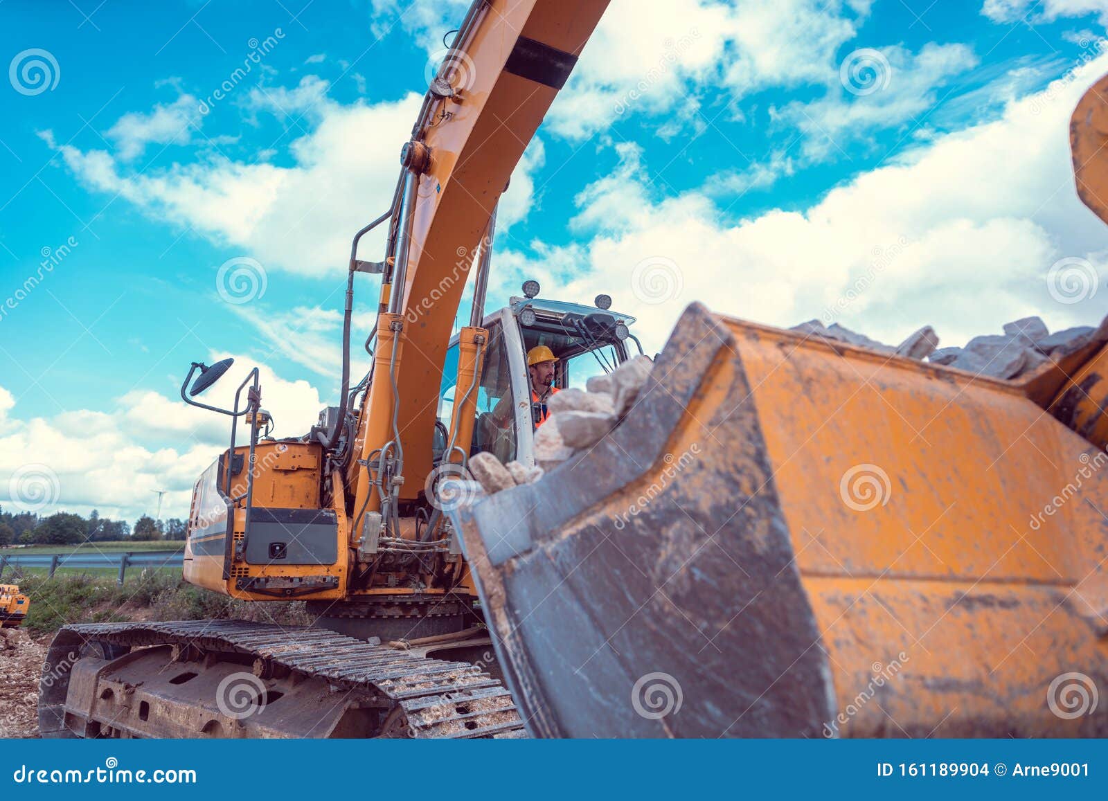 Construction Worker Operating the Crawler Excavator Stock Photo - Image ...