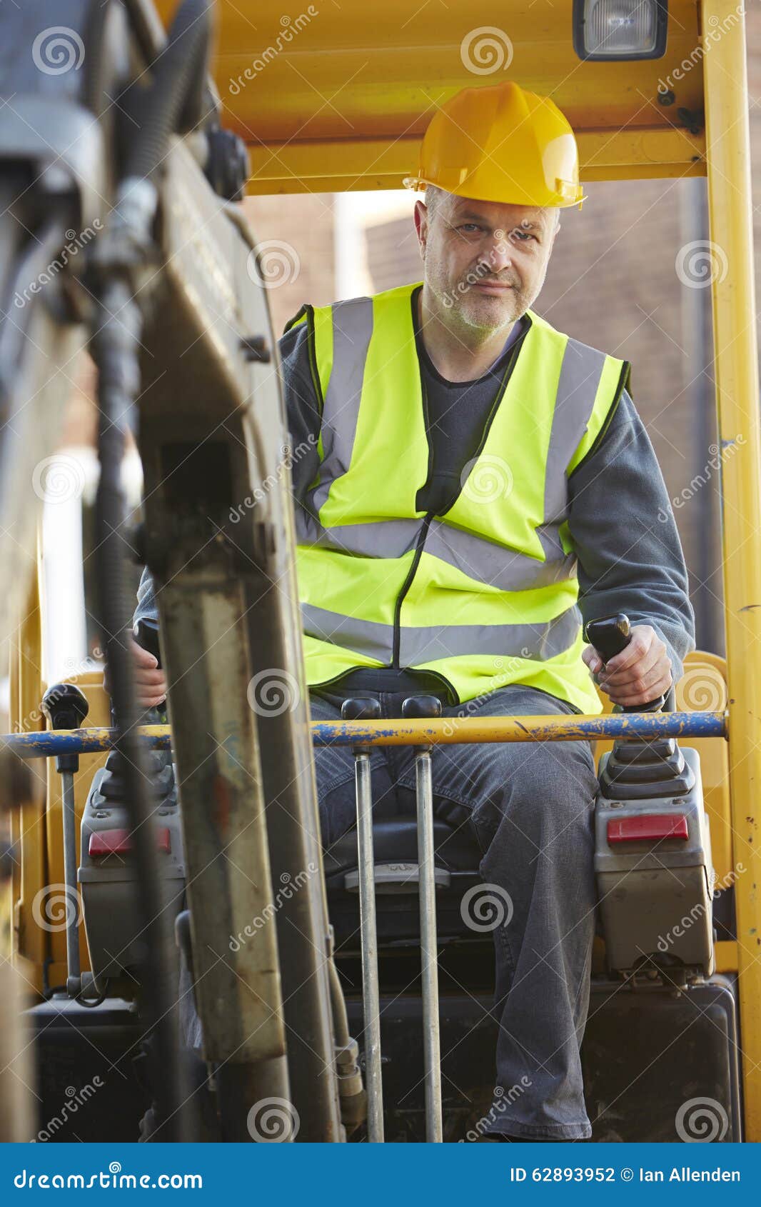 Construction Worker Operating Digger on Site Stock Photo - Image of ...