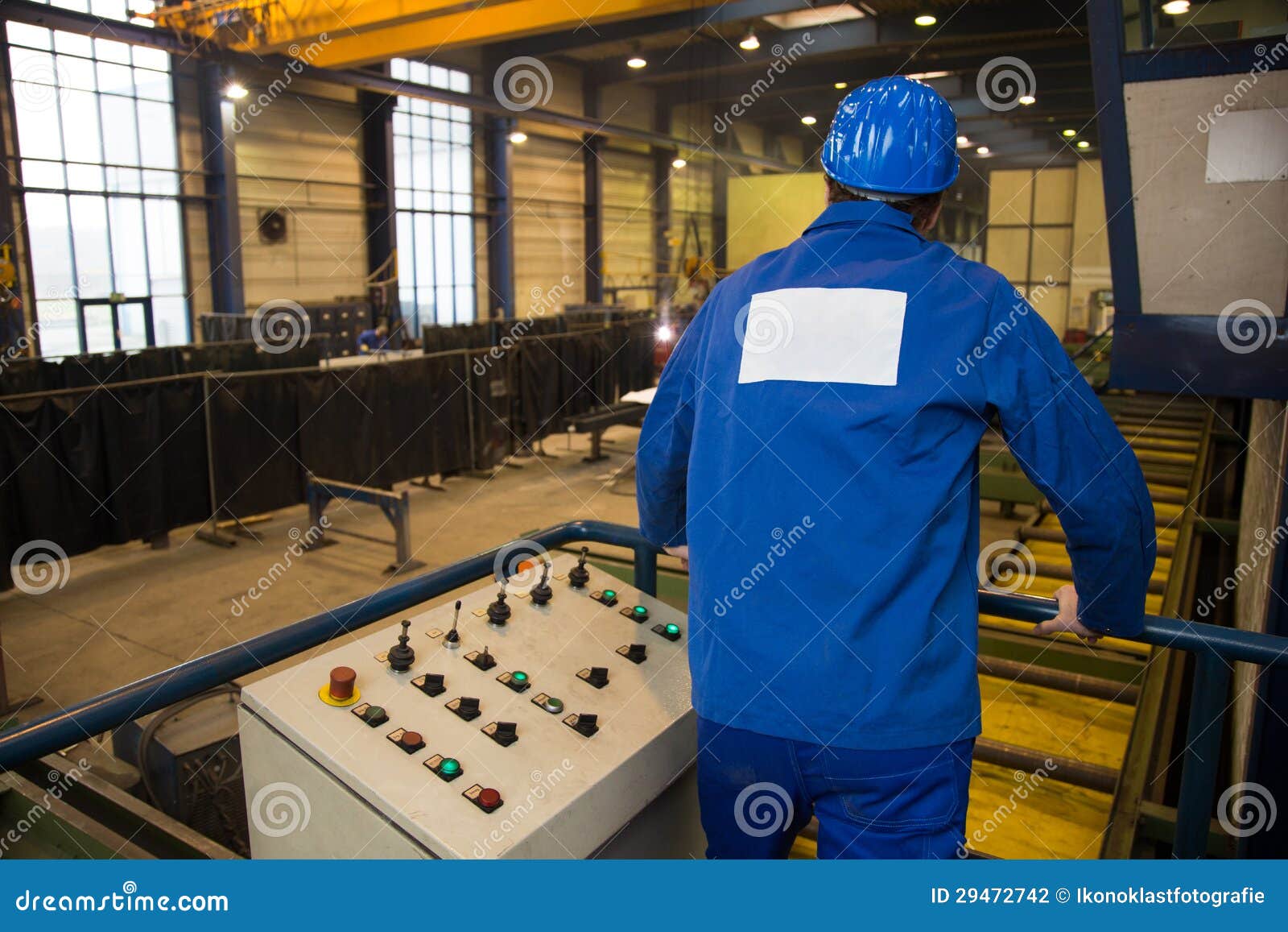 Construction Worker Operating a Machine Stock Photo - Image of male ...