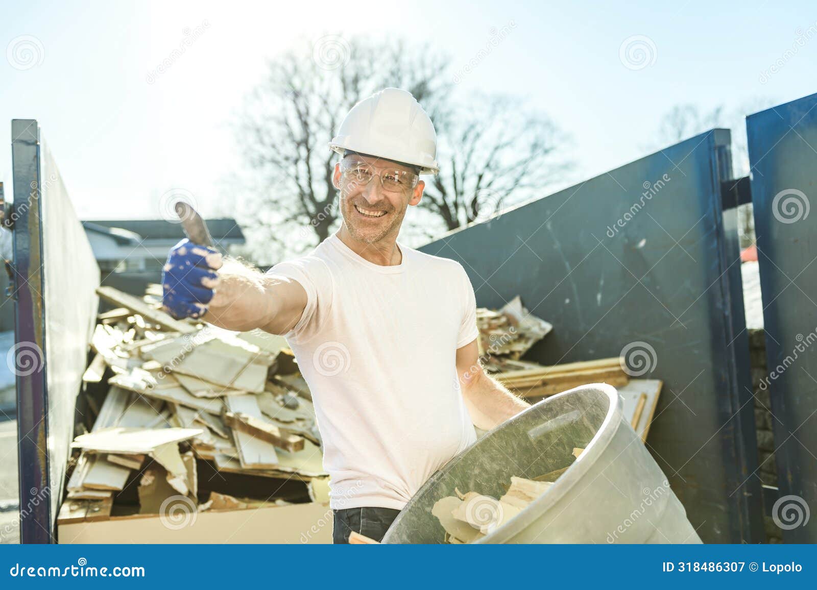 Construction Worker Outside of House Put Old Renovation Material on Big ...