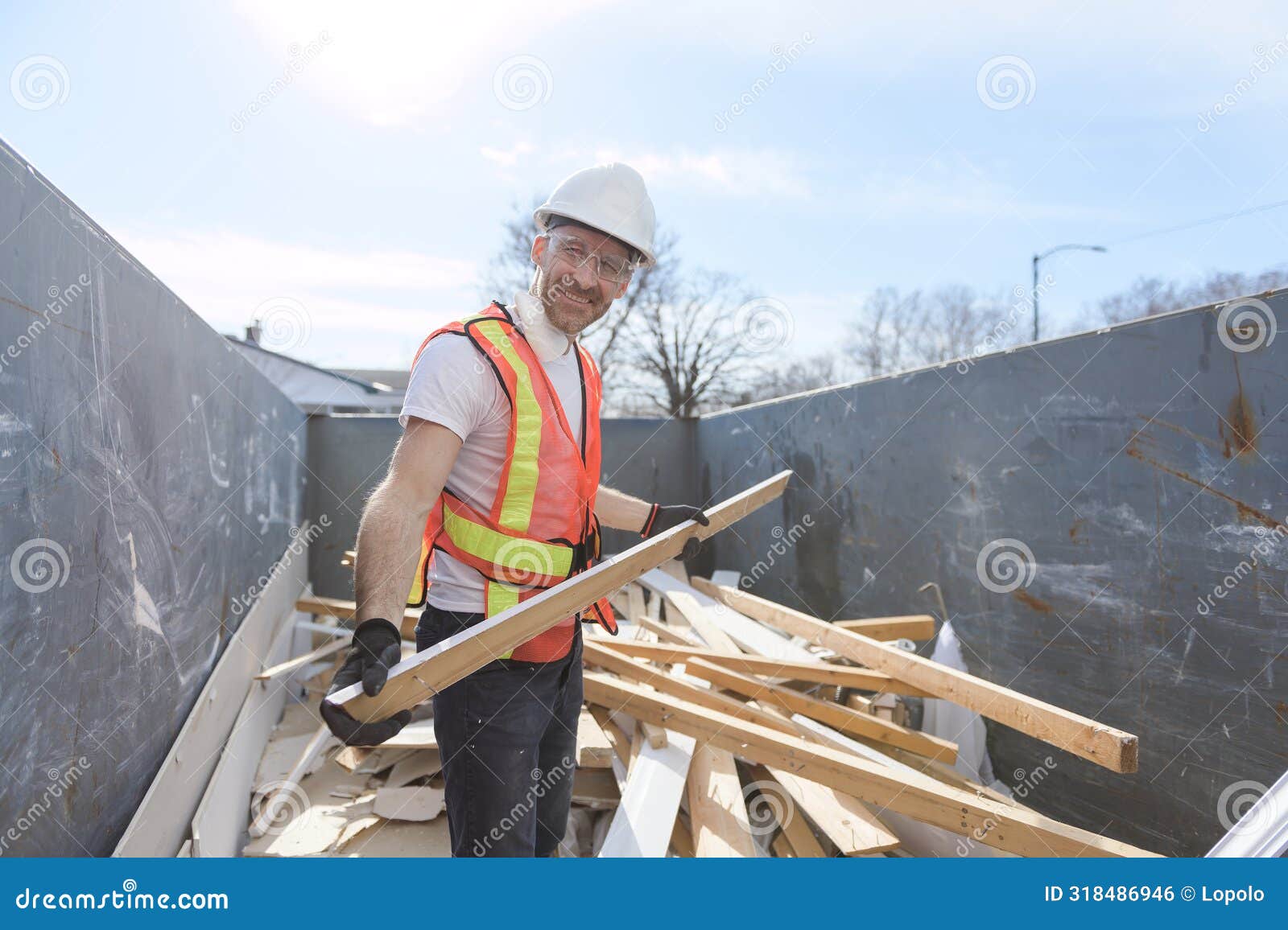 Construction Worker Outside of House Put Old Renovation Material on Big ...
