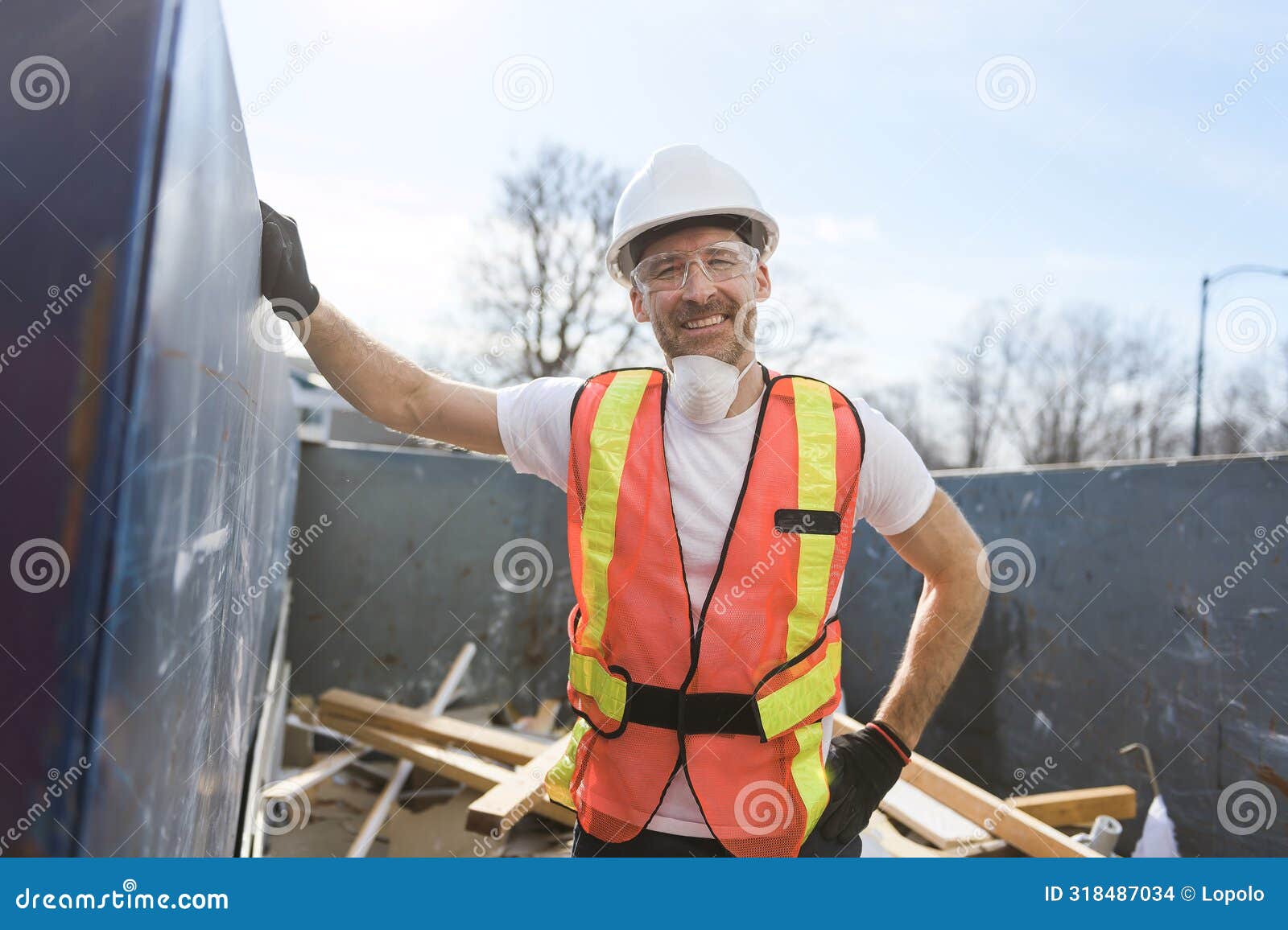 Construction Worker Outside of House Put Old Renovation Material on Big ...