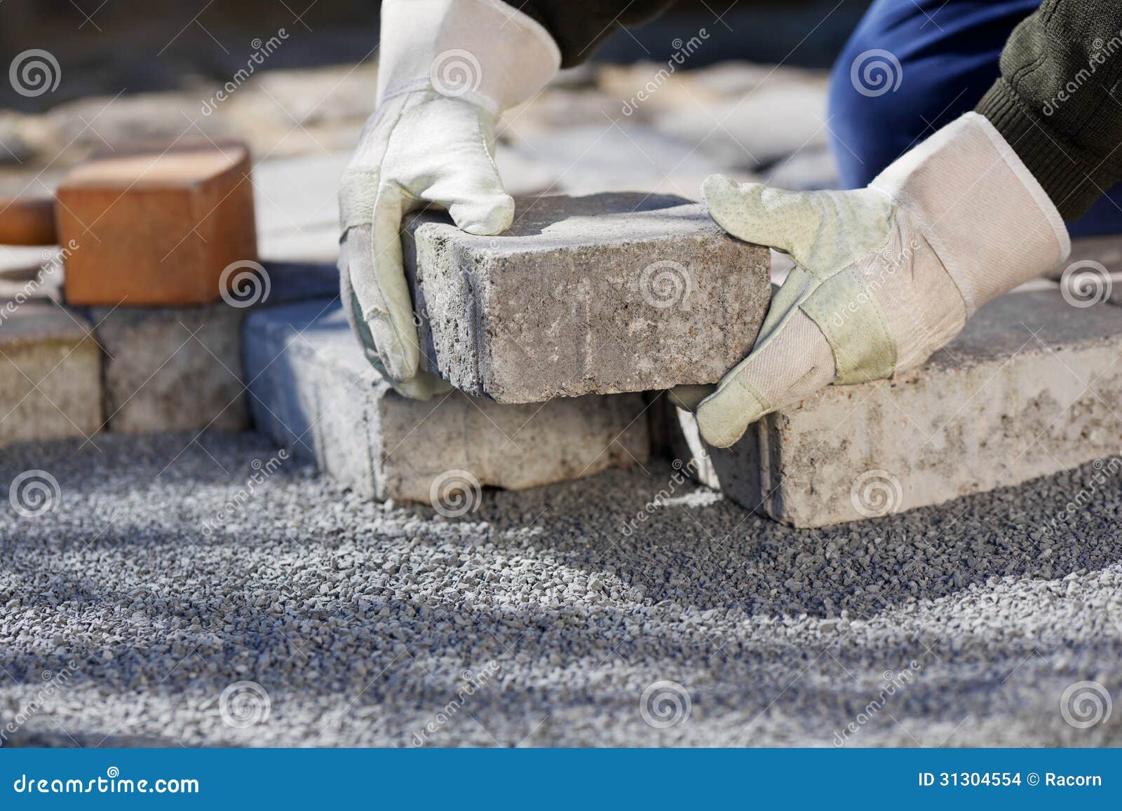 Construction Worker Paving the Brick Road Stock Photo - Image of ...