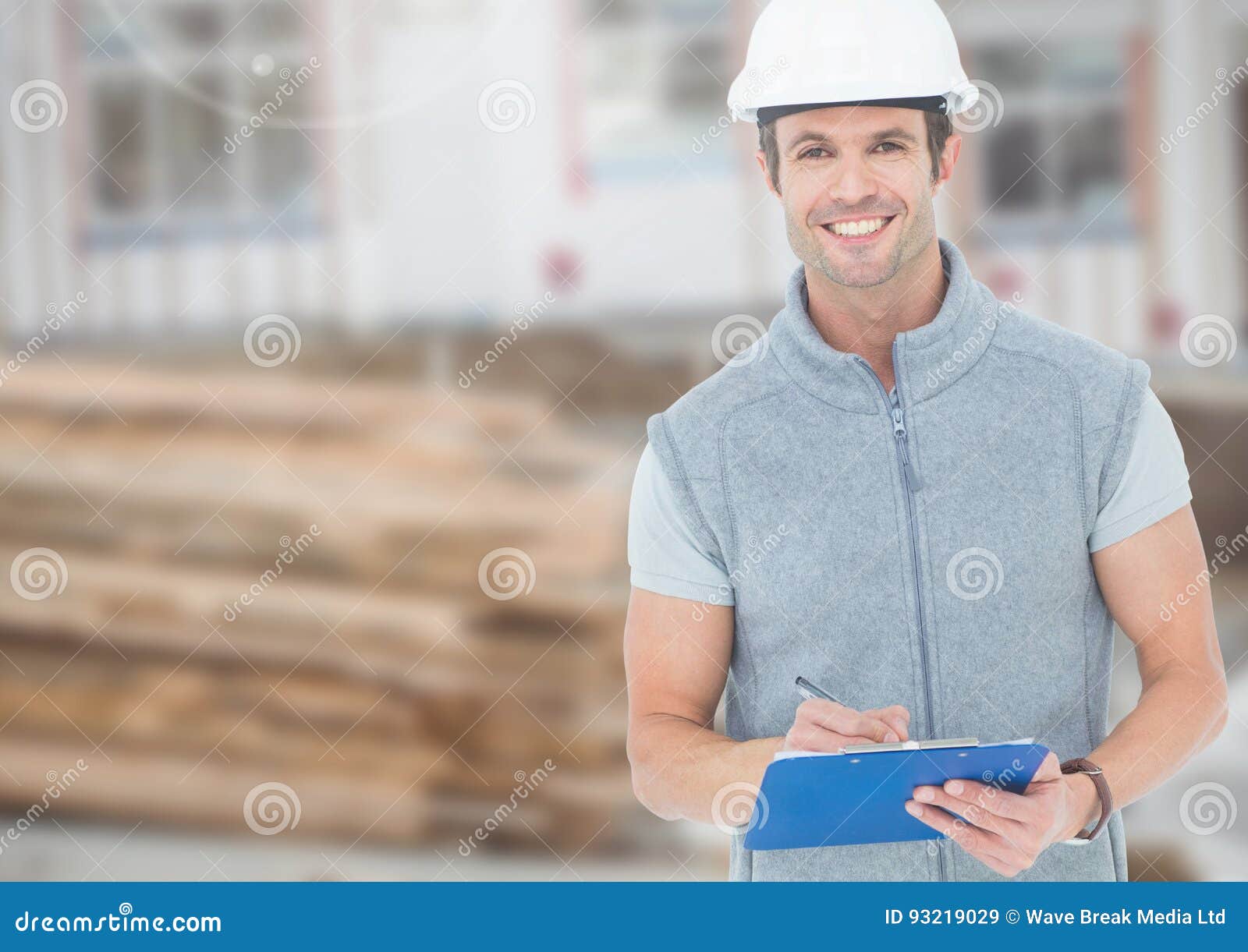 Construction Worker with Pen Chart in Front of Construction Site Stock ...