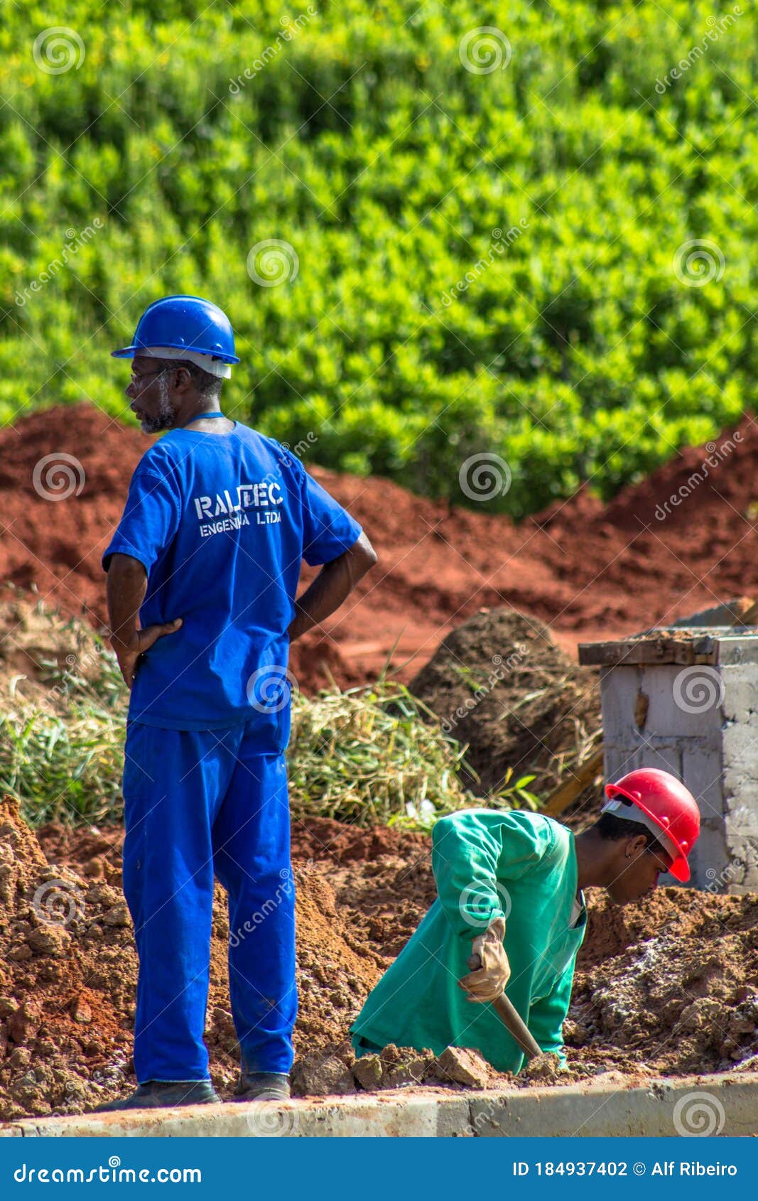 Construction Worker Performs the Construction of the Factory Shed ...