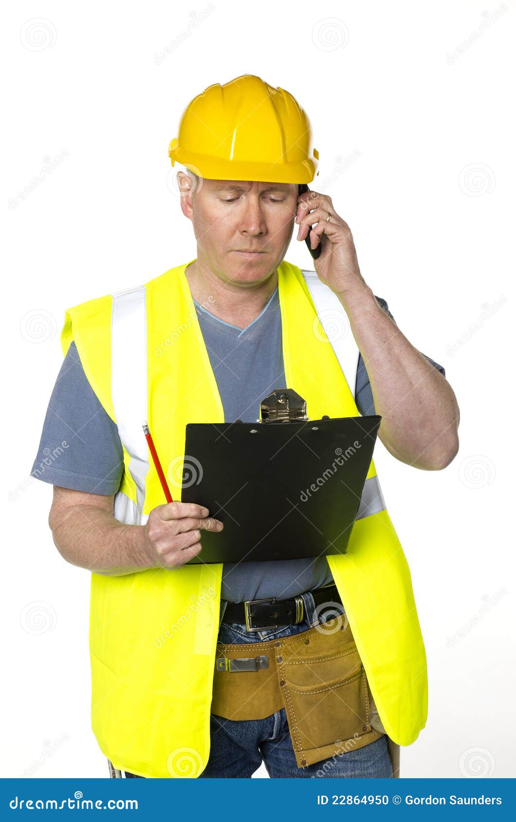 Construction Worker Phones and Looks at Clipboard Stock Photo - Image ...