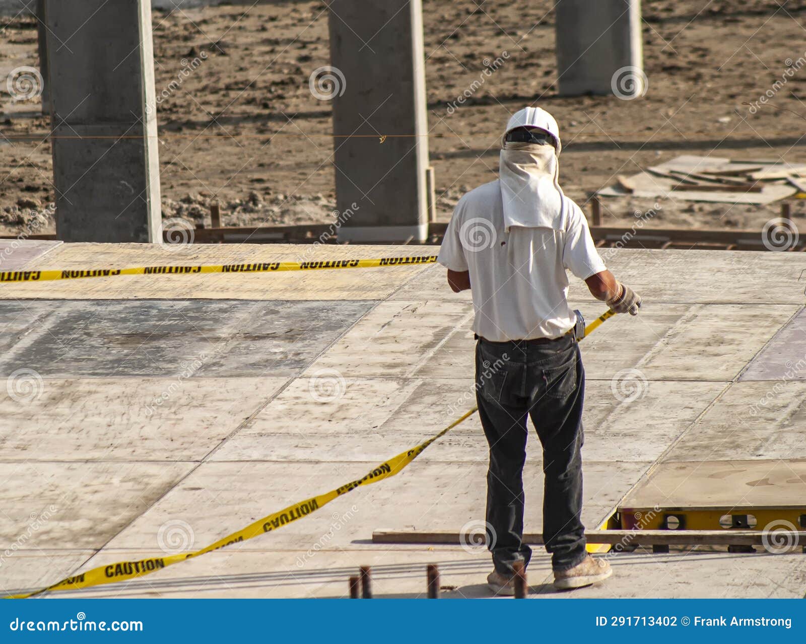 Construction Worker Placing Caution Tape at a Construction Site Stock ...