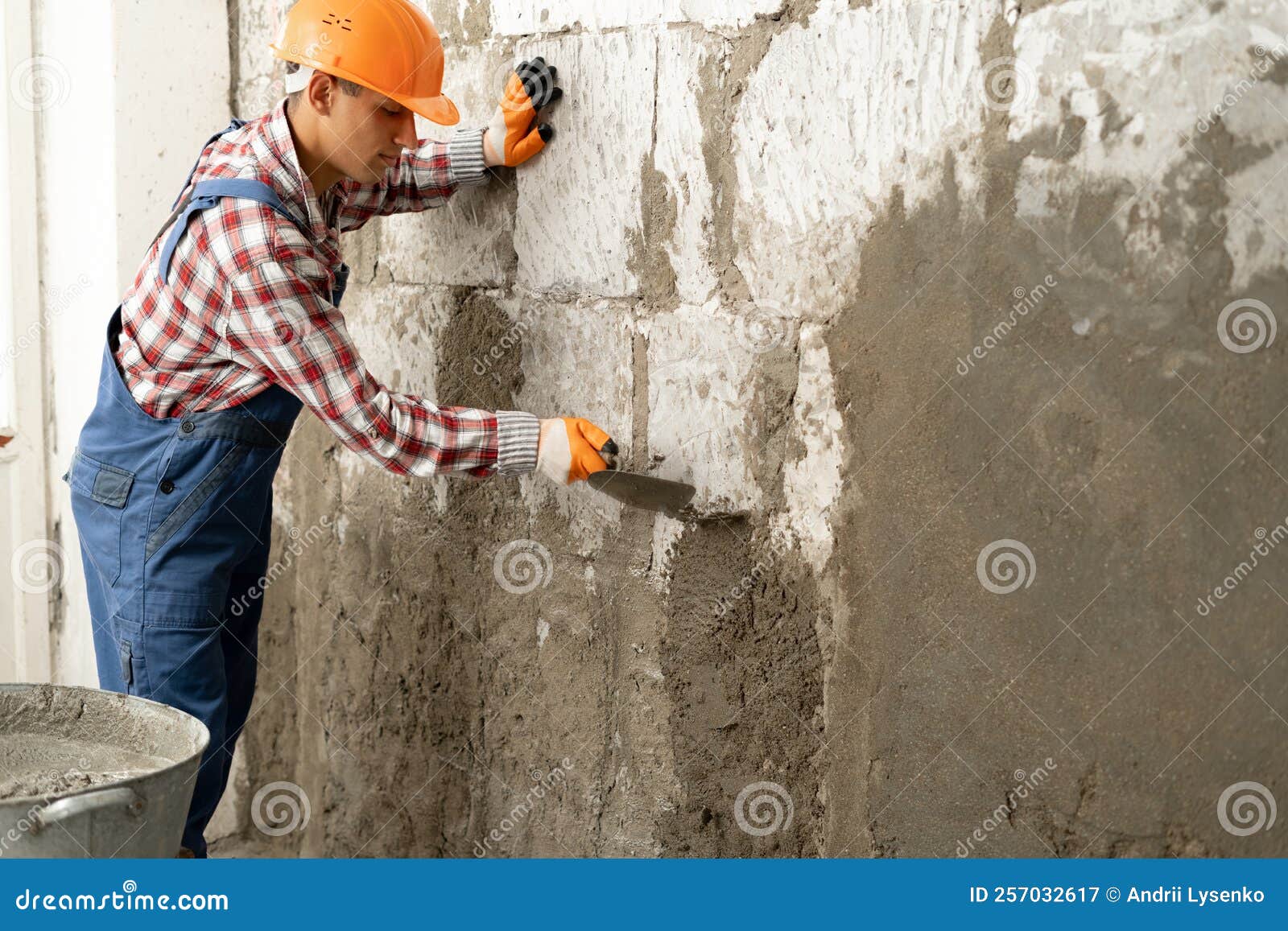 Construction Worker Plasterer with Trowel Plastering Wall Cement Mortar ...