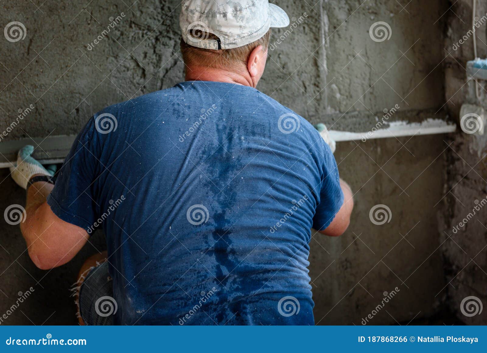 Construction Worker Plastering Wall with Leveler Stock Photo - Image of ...