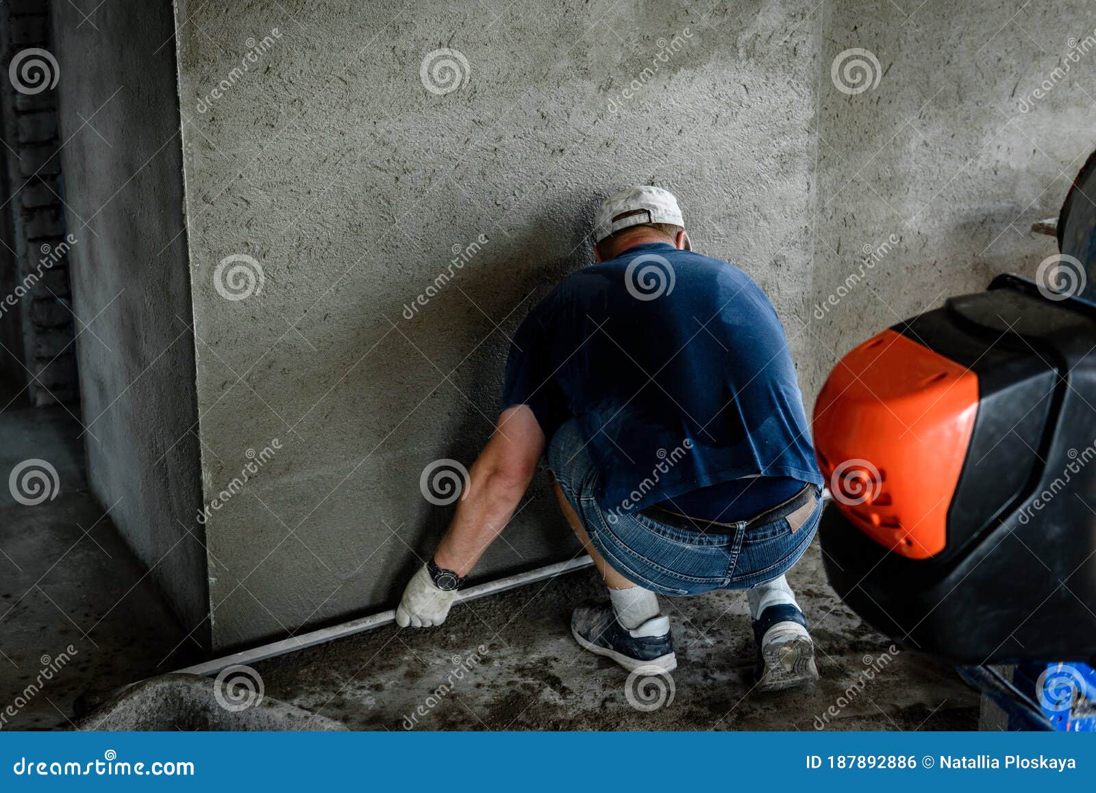 Construction Worker Plastering Wall with Leveler Stock Photo - Image of ...