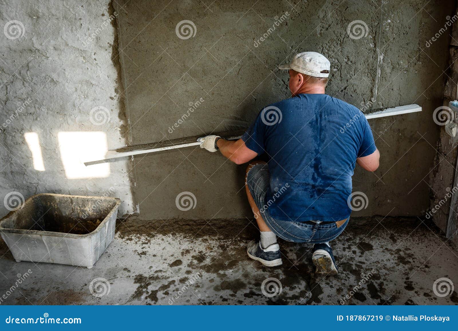 Construction Worker Plastering Wall with Leveler Stock Image - Image of ...