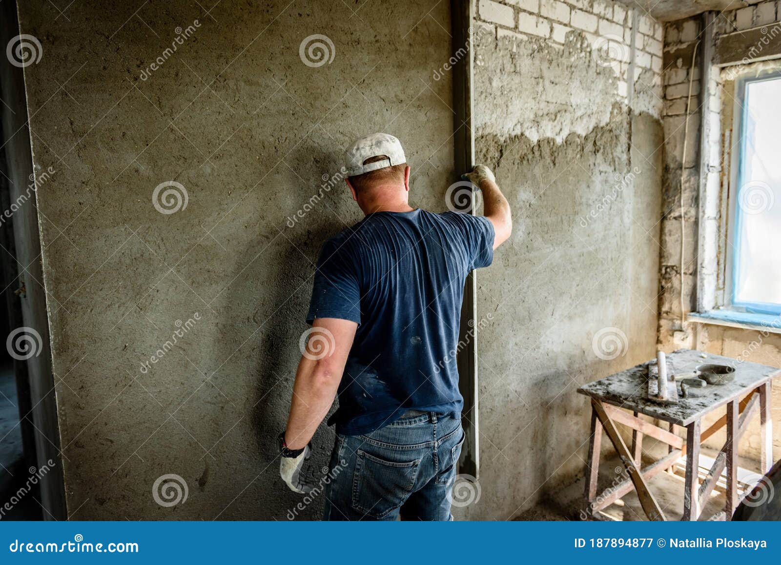 Construction Worker Plastering Wall with Leveler Stock Image - Image of ...