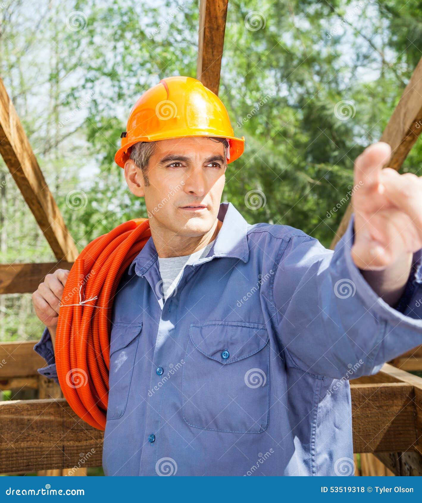 Construction Worker Pointing at Site Stock Photo - Image of ...