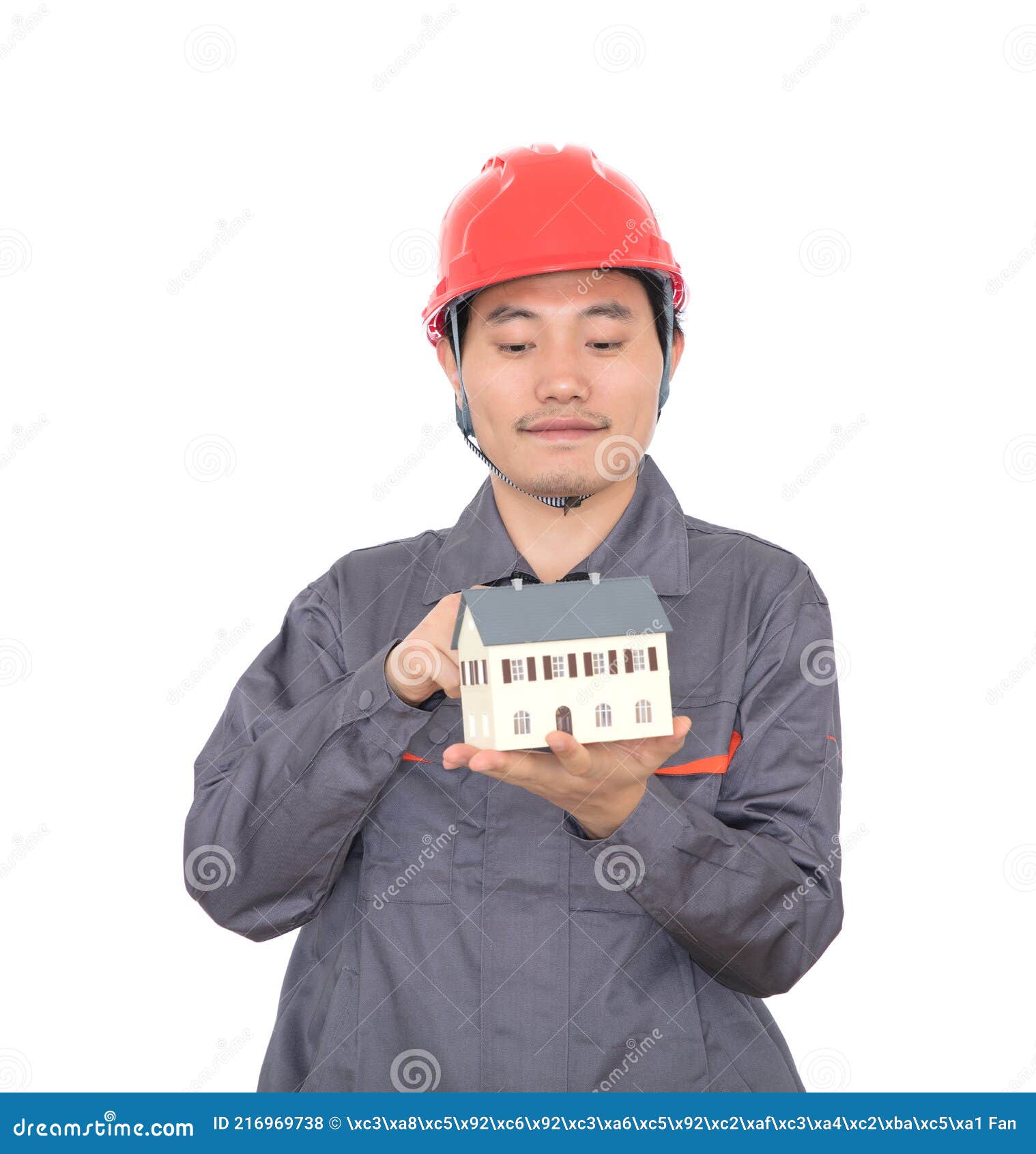 Construction Worker Pointing at Small House Model in Hand Stock Photo ...