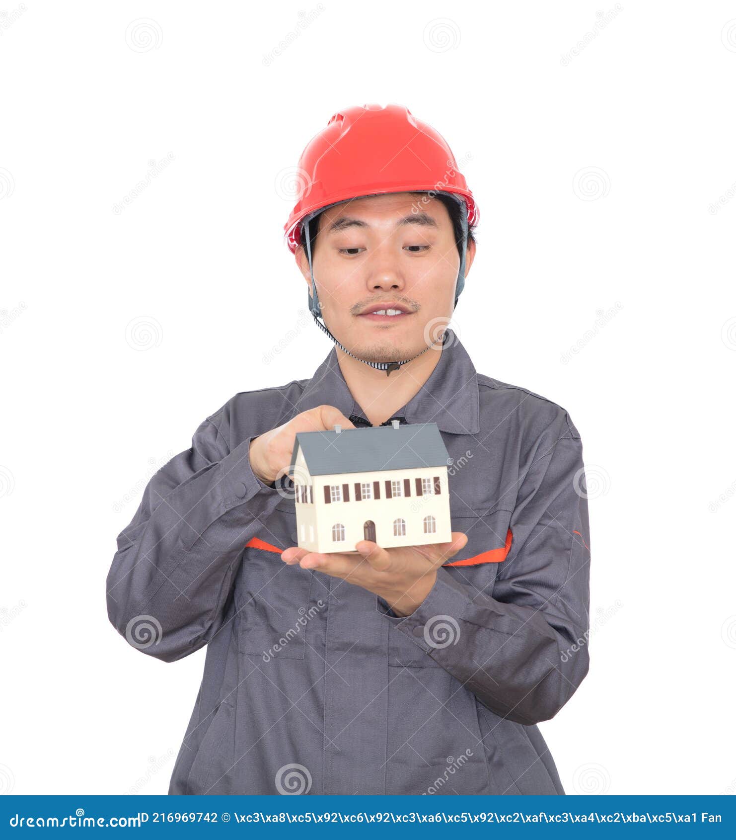 Construction Worker Pointing at Small House Model in Hand Stock Photo ...