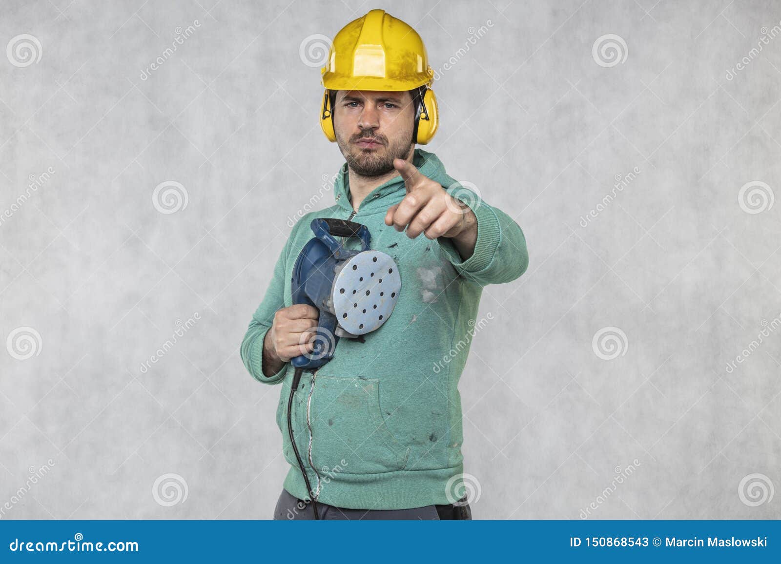 The Construction Worker Points His Finger at You, the Grinder in His ...