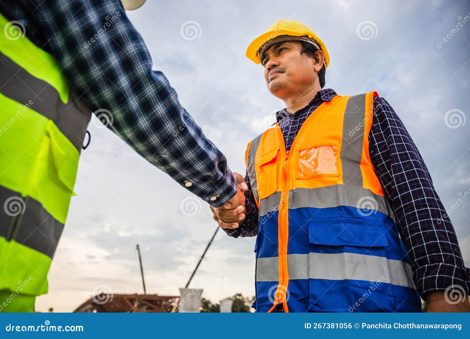 Construction Worker in Protective Uniform Shaking Hands with ...