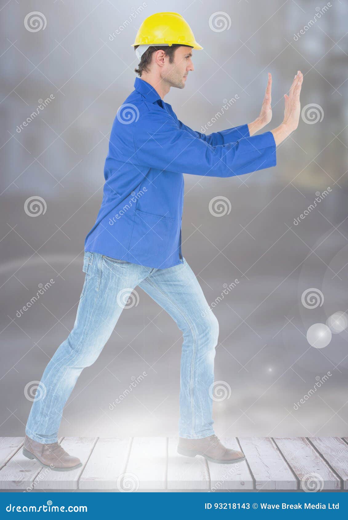 Construction Worker Pushing Air Force in Front of Construction Site ...
