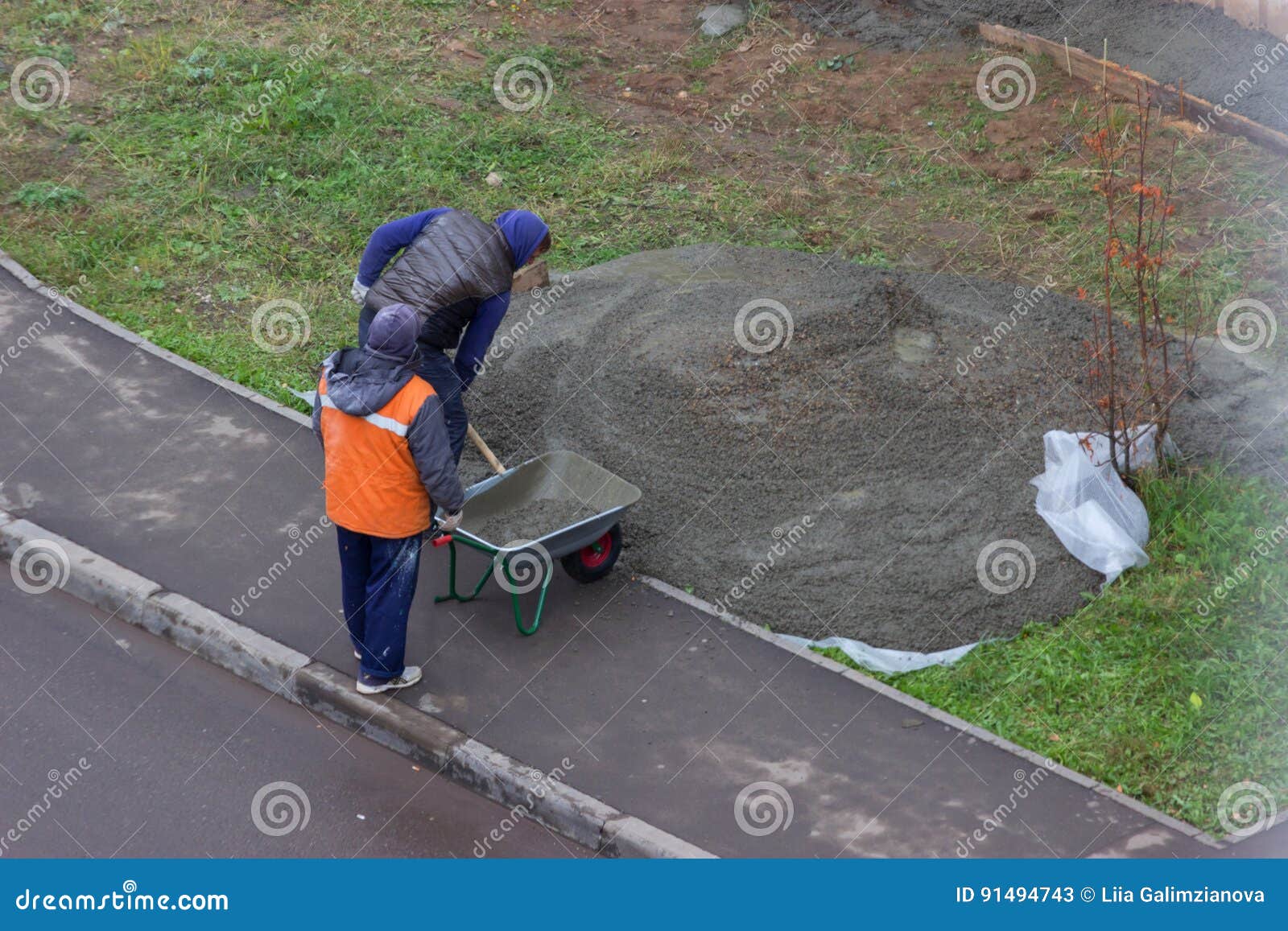Construction Worker Pushing a Wheelbarrow Stock Image - Image of ...