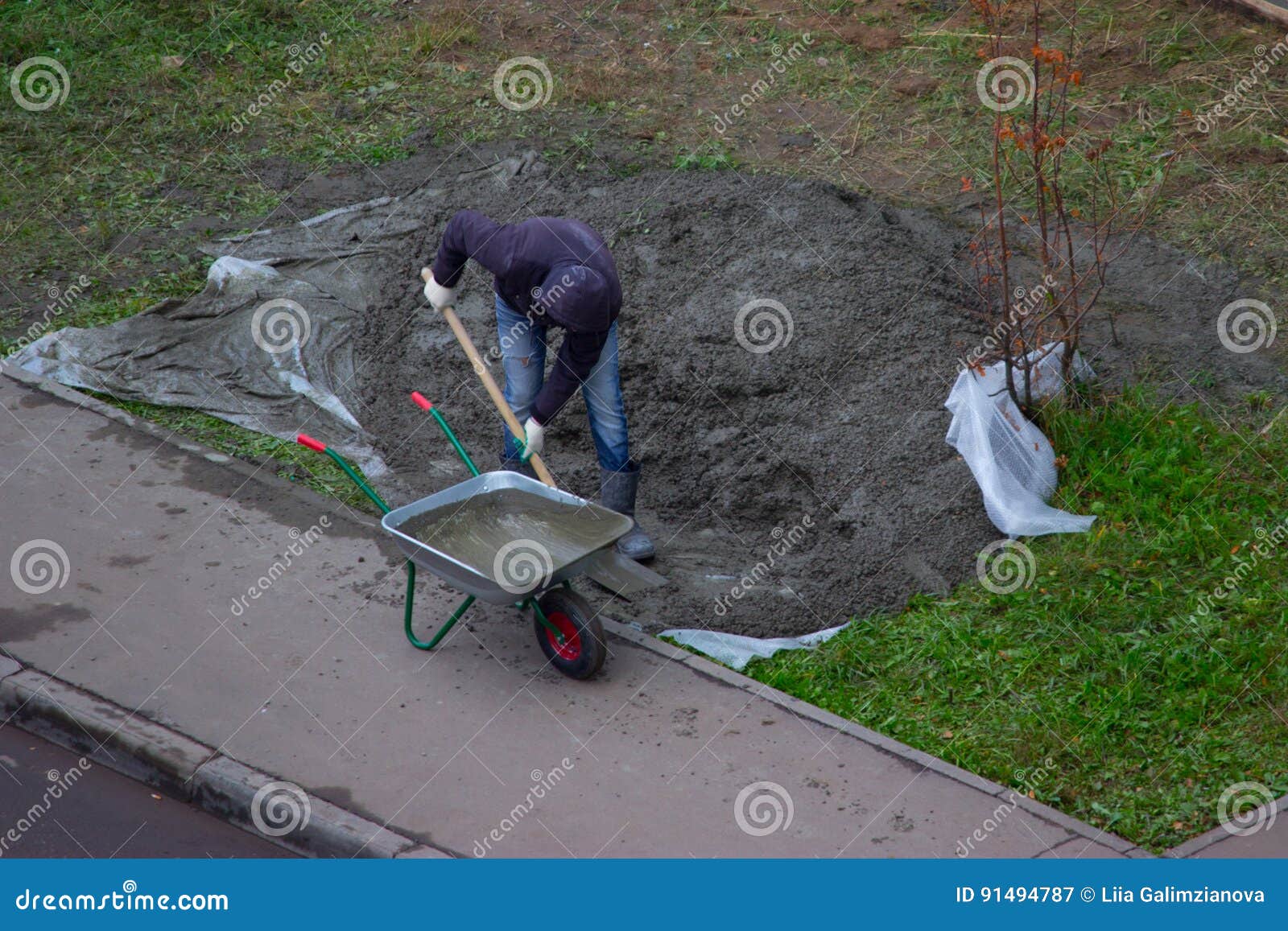 Construction Worker Pushing a Wheelbarrow Stock Image - Image of ...