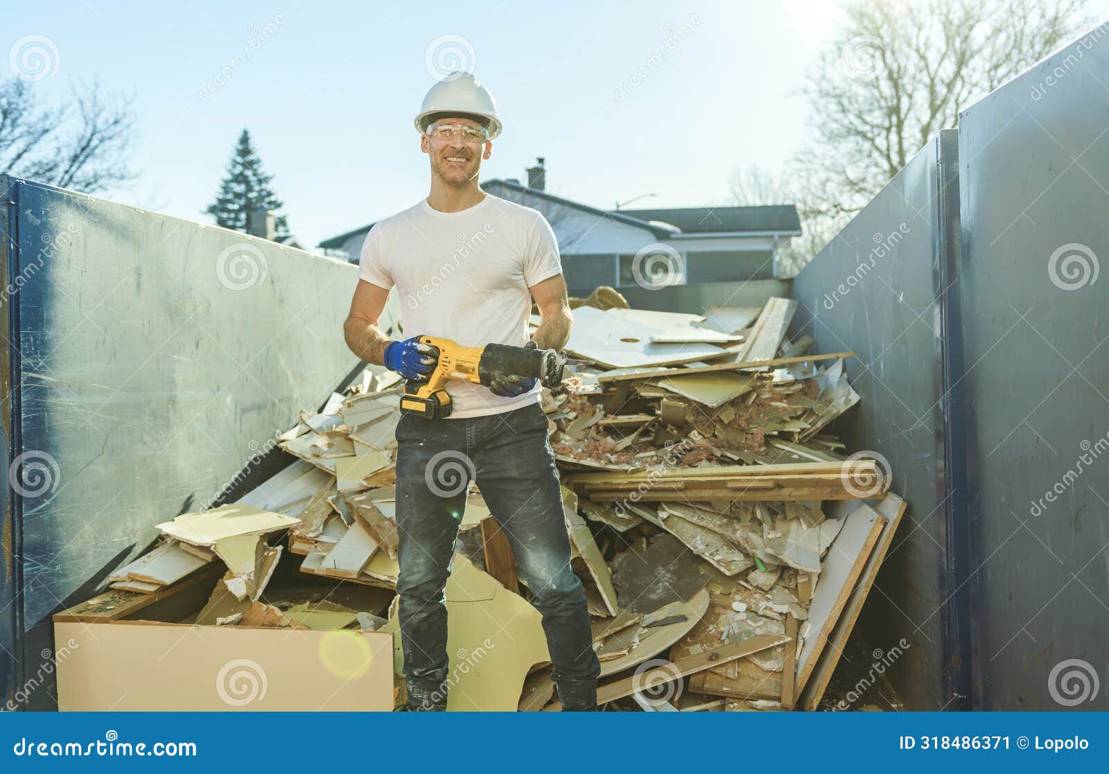 Construction Worker Outside of House Put Old Renovation Material on Big ...