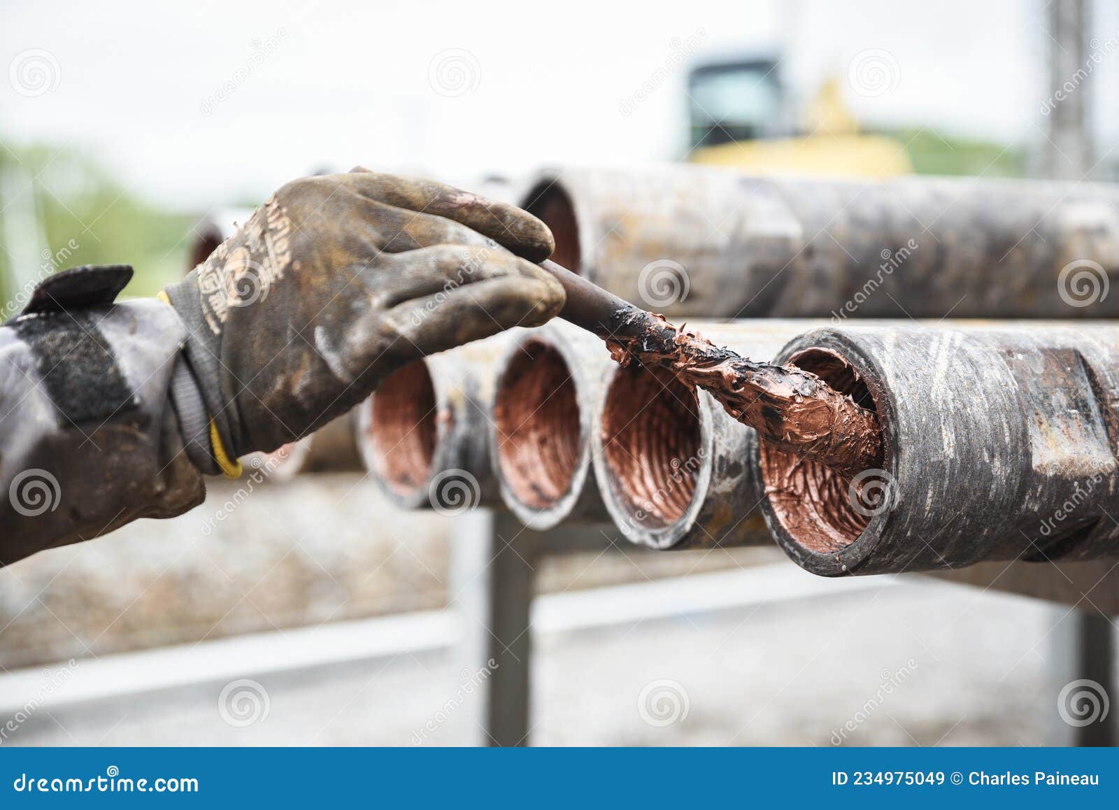 Construction Worker Putting Grease on a Pipe Stock Image - Image of ...