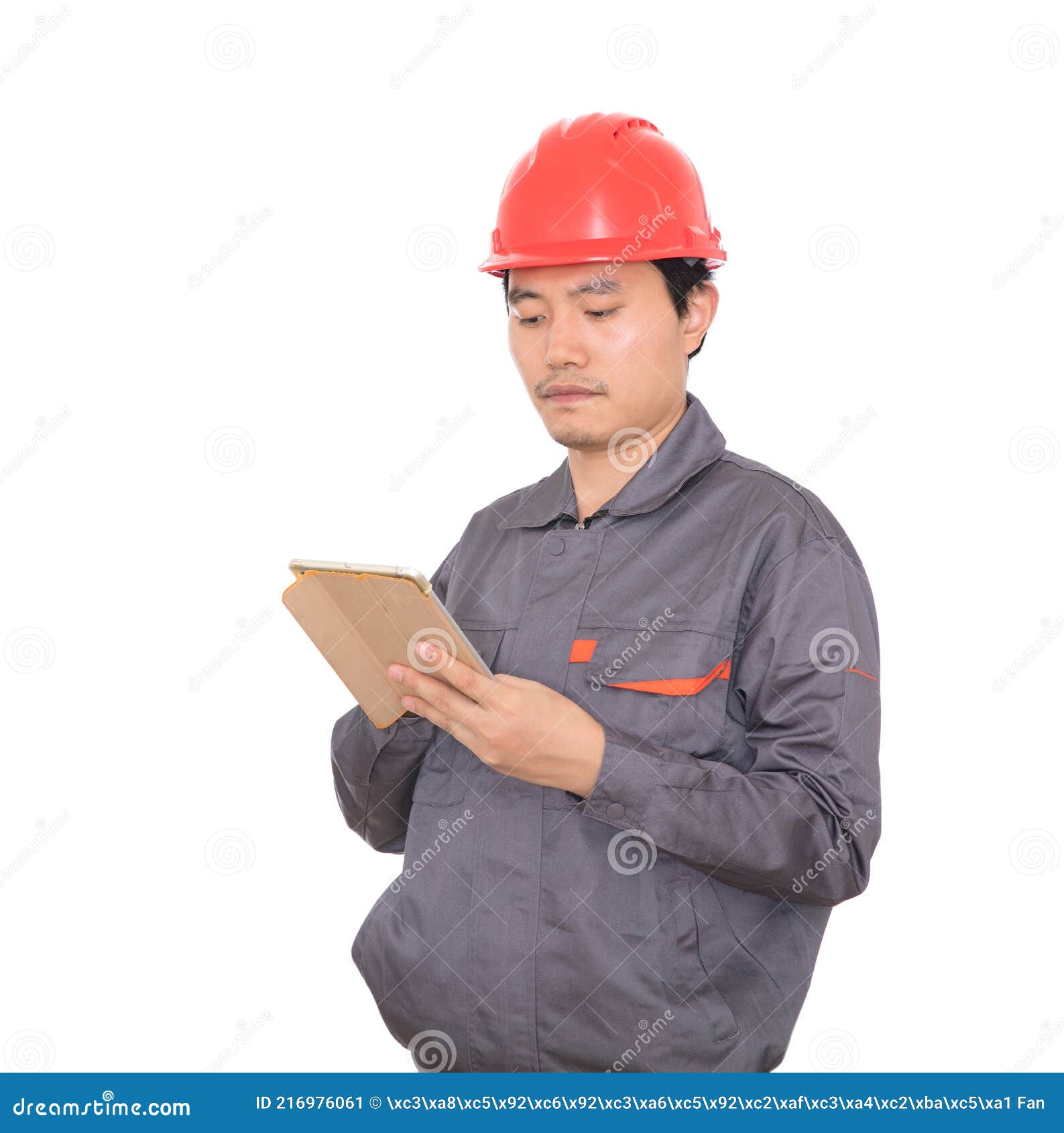 Construction Worker with Red Hard Hat Holding Ipad in Hand Standing in ...