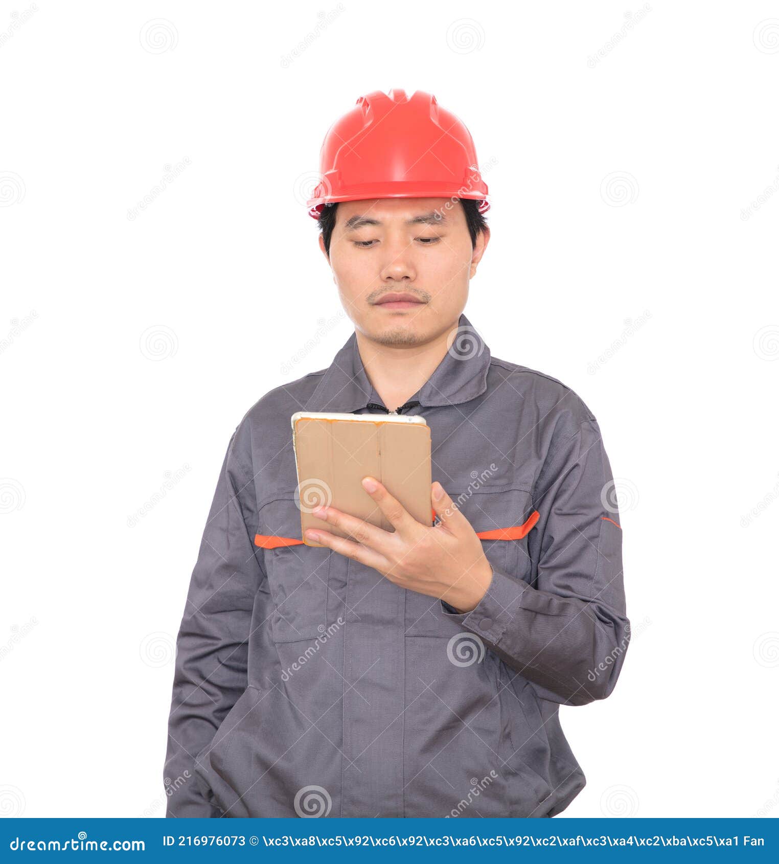 Construction Worker with Red Hard Hat Holding Ipad in Hand Standing in ...