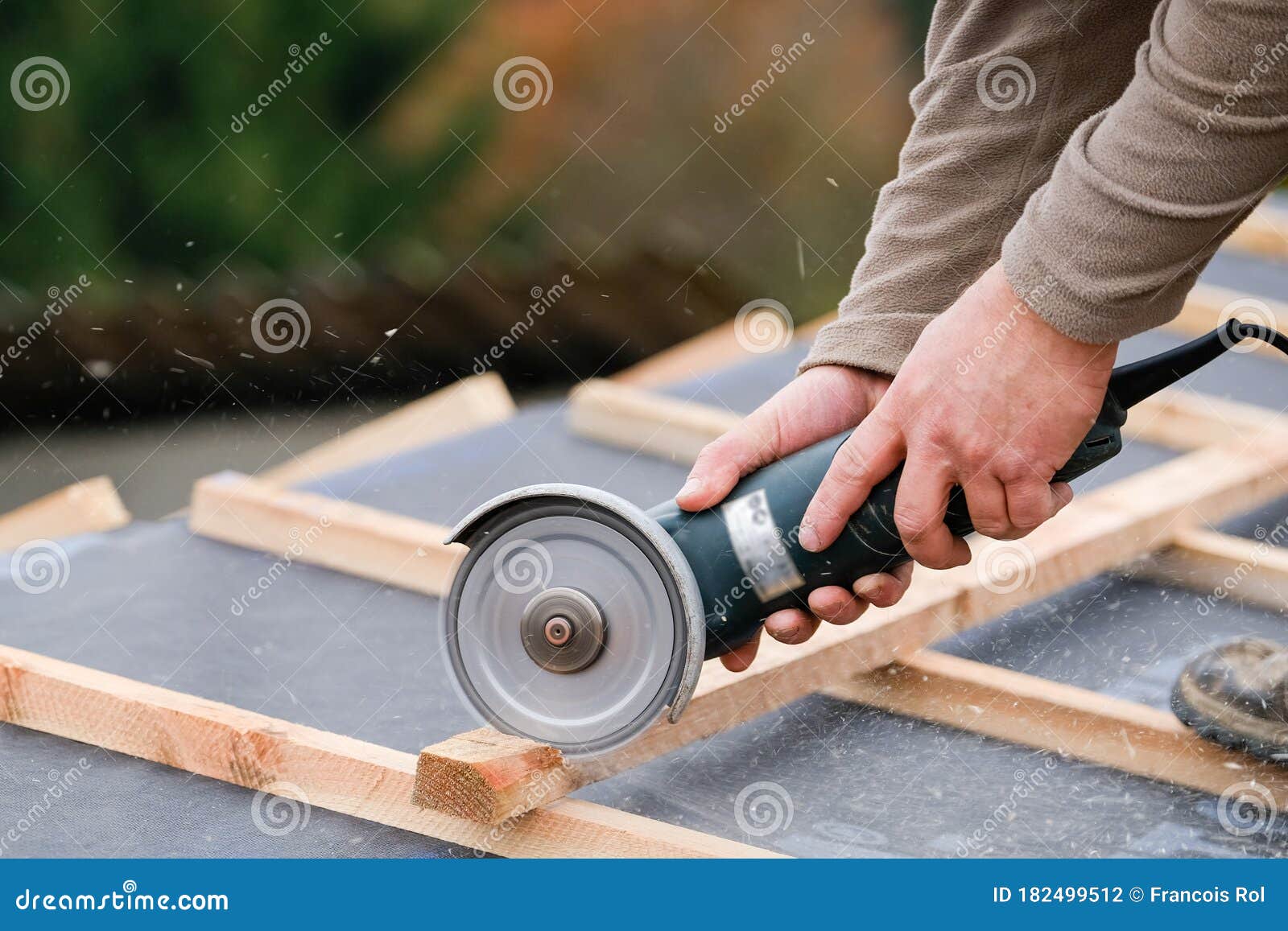 Construction Worker Installing the Wooden Infrastructure of a Roof ...