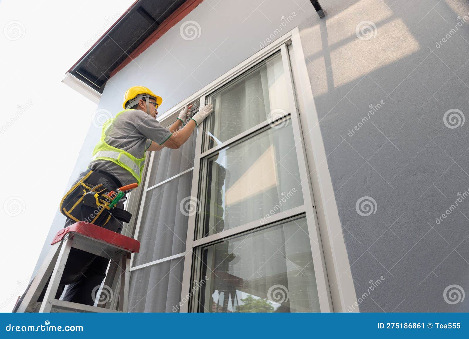 Construction Worker Repairing the Sliding Window. Open Cap of Adjust ...