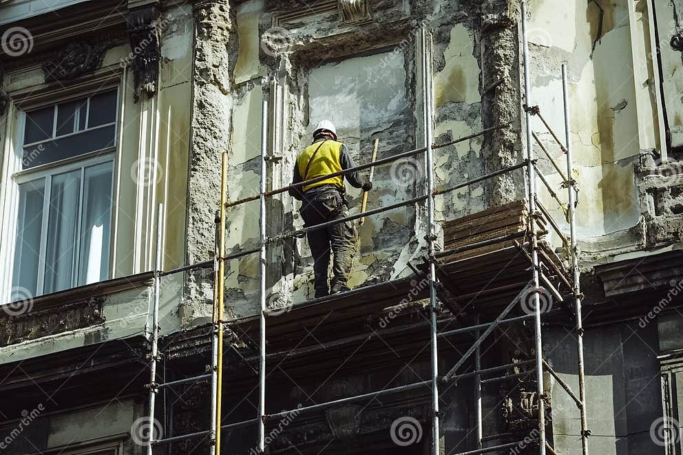 Construction Worker Restoring Facade of Old Building Using Scaffolding ...
