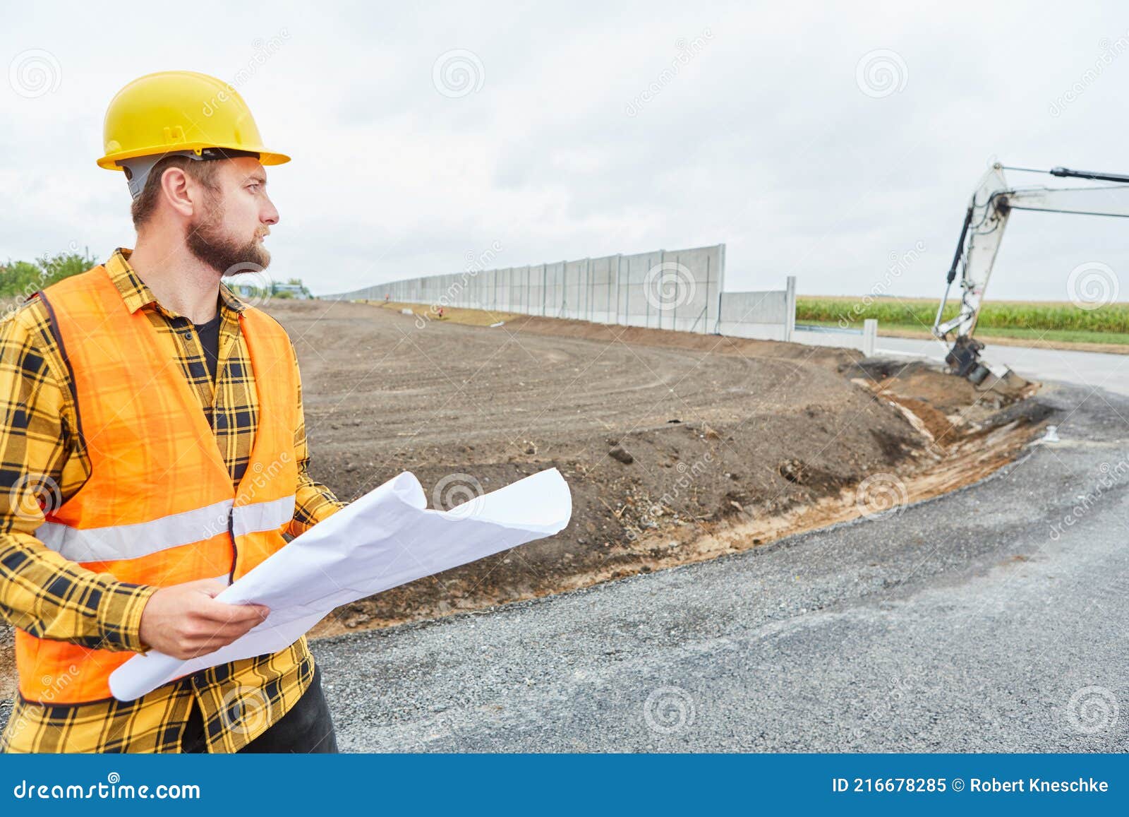 Construction Worker in Road Construction with Site Plan on Construction ...