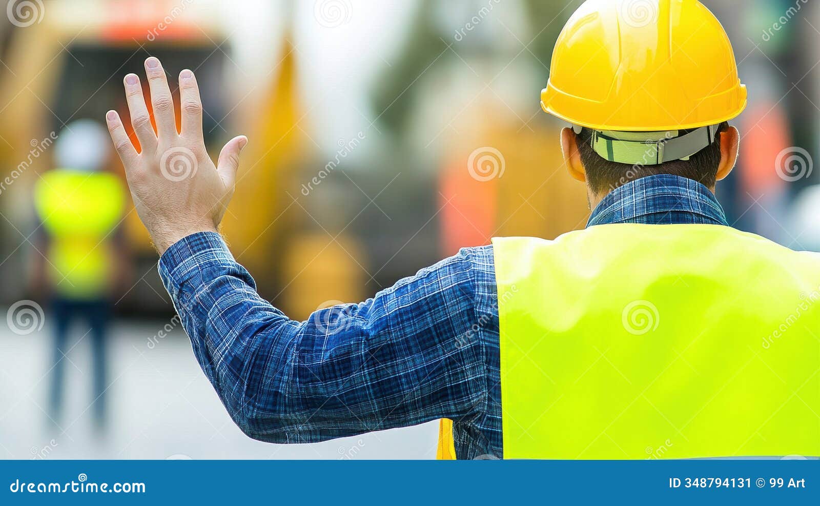 Construction Worker in Safety Gear Waving at Job Site in Daylight Stock ...