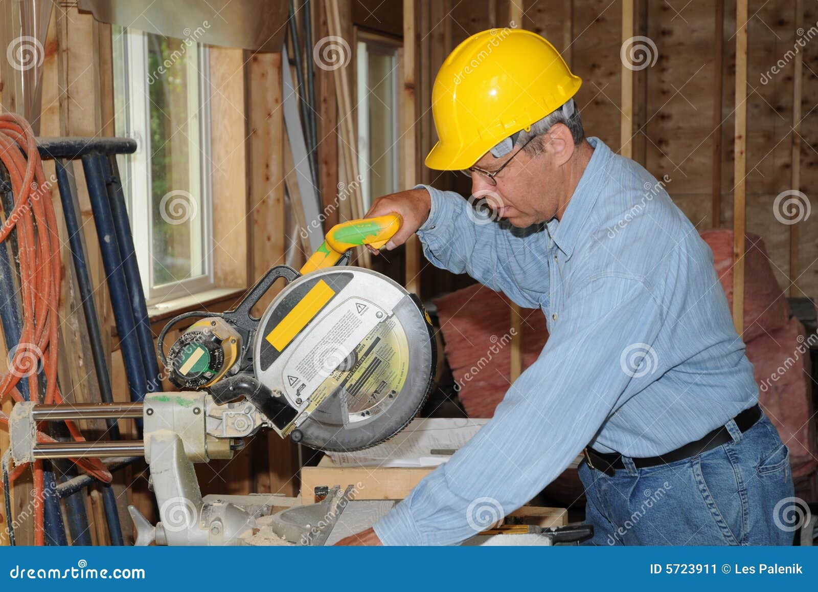 Construction Worker with a Saw Stock Image - Image of yellow, carpenter ...