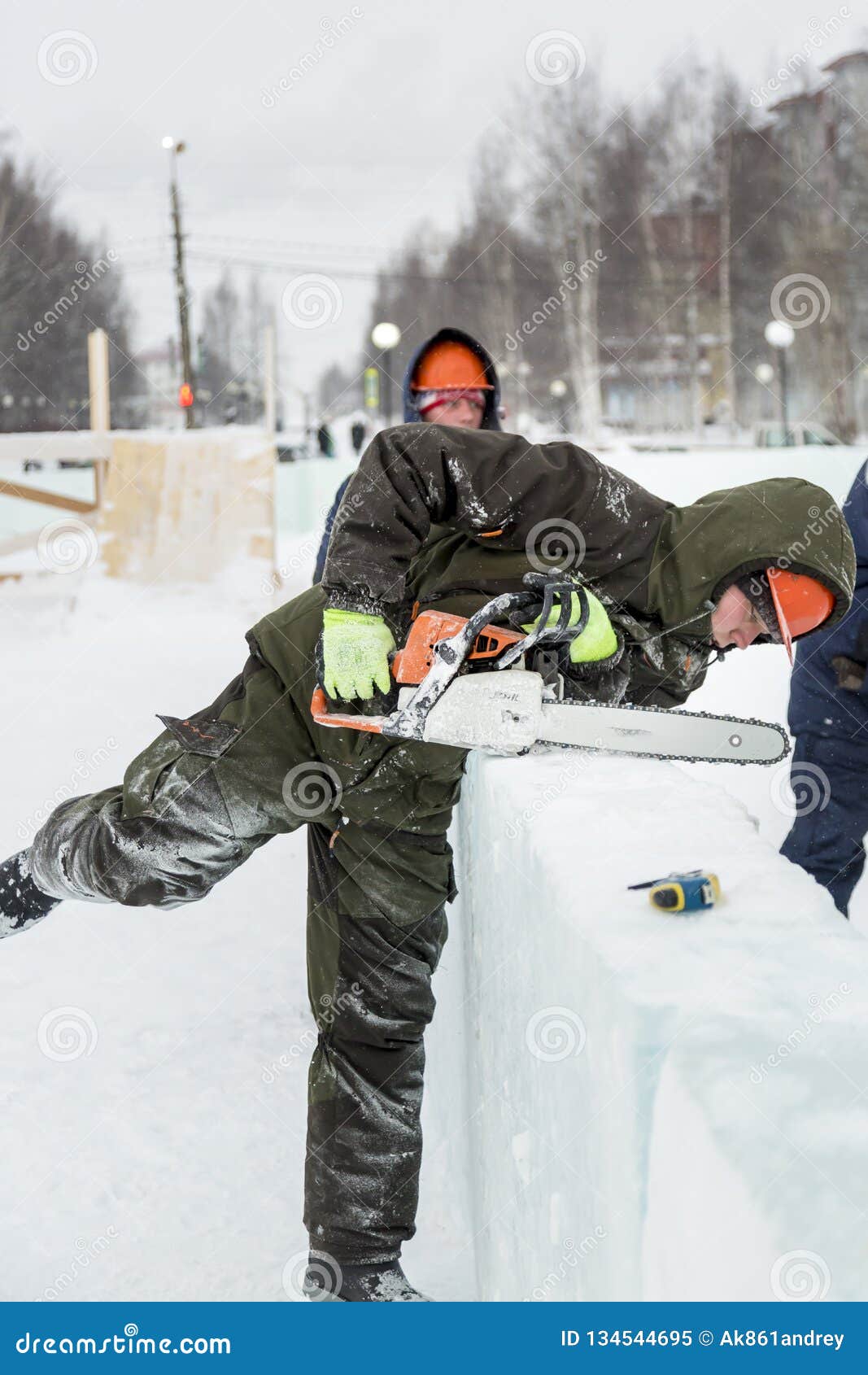 Worker Cuts a Lump of Ice with a Chainsaw Stock Image - Image of plate ...