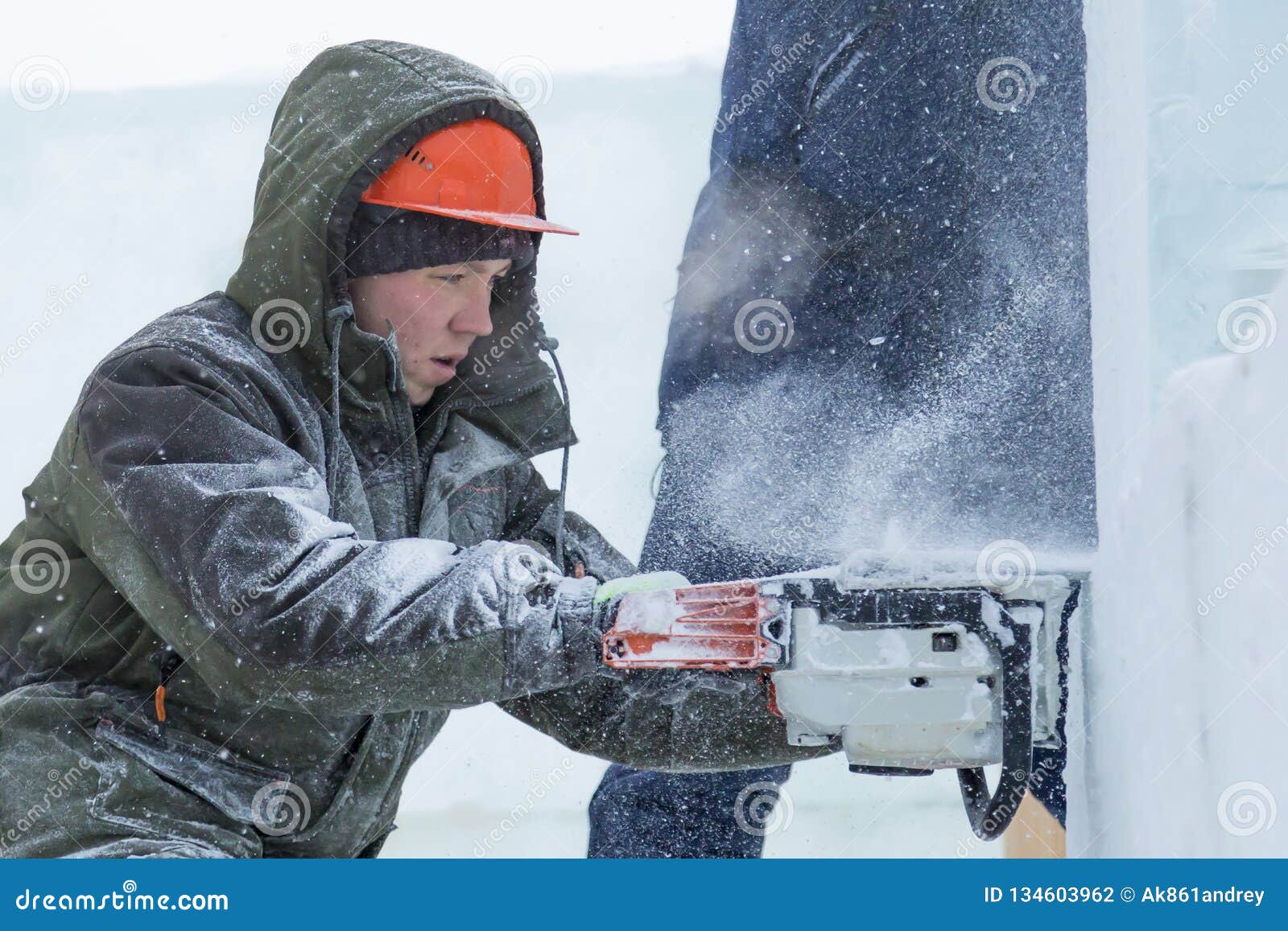 Worker Cuts a Lump of Ice with a Chainsaw Stock Photo - Image of ...