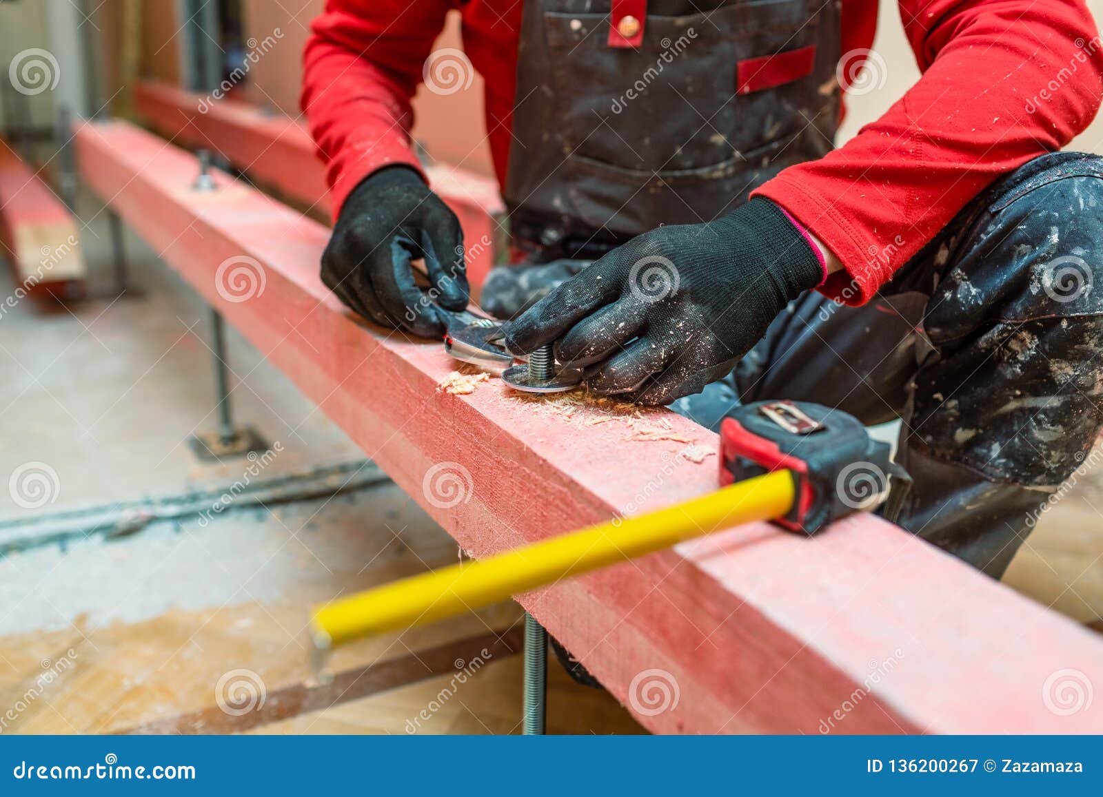 Construction Worker Screws Bolts Up Tight on the Stud on the Wooden ...