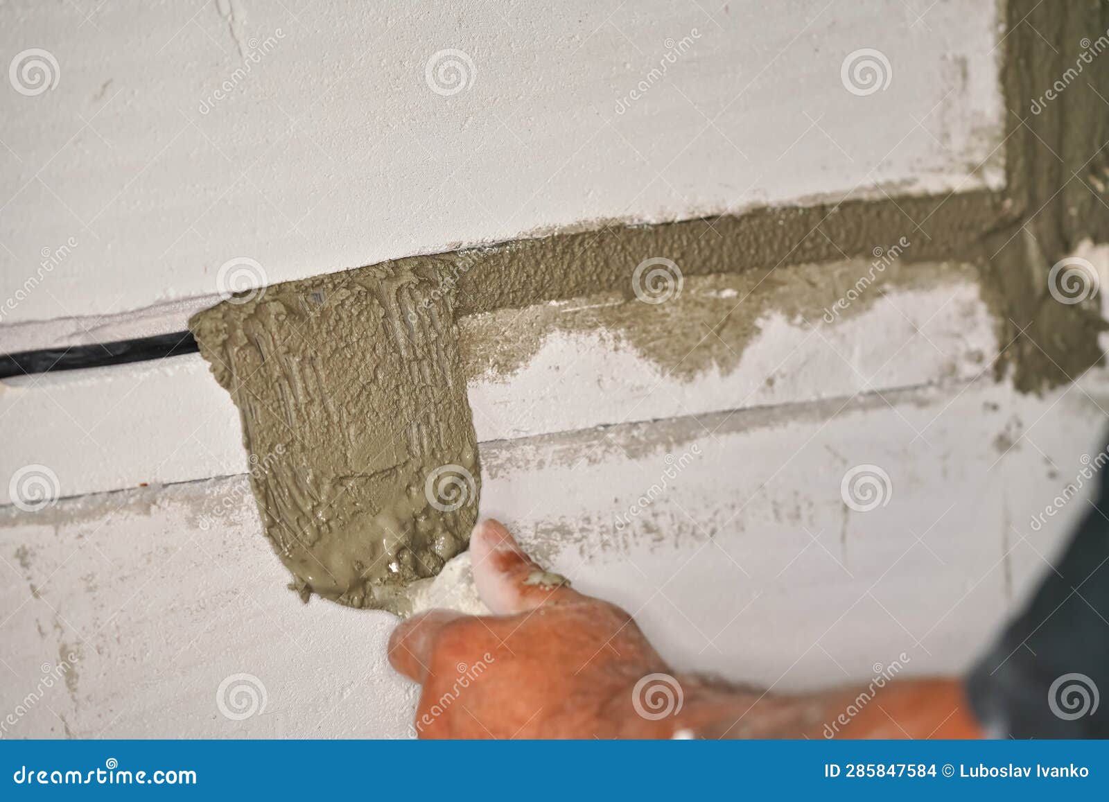 Construction Worker Securing Electric Sockets Groove Installed on Bare ...