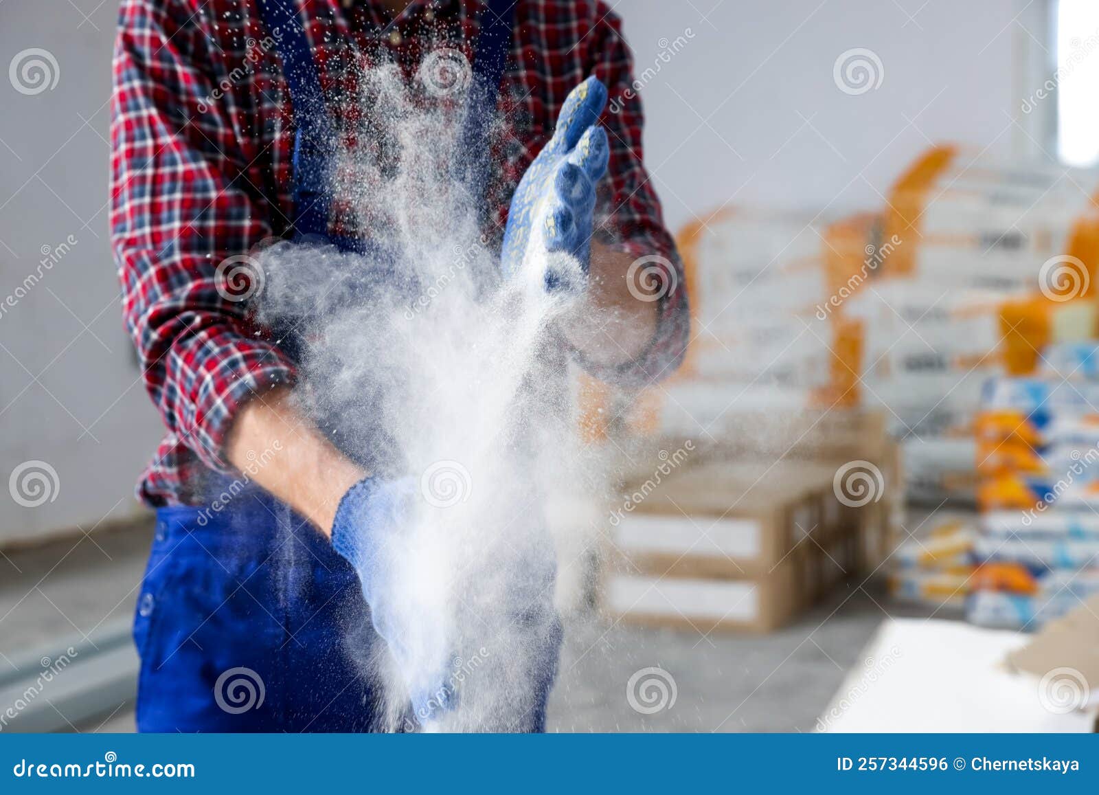 Construction Worker Shaking Off Dust from Hands in Room Prepared for ...