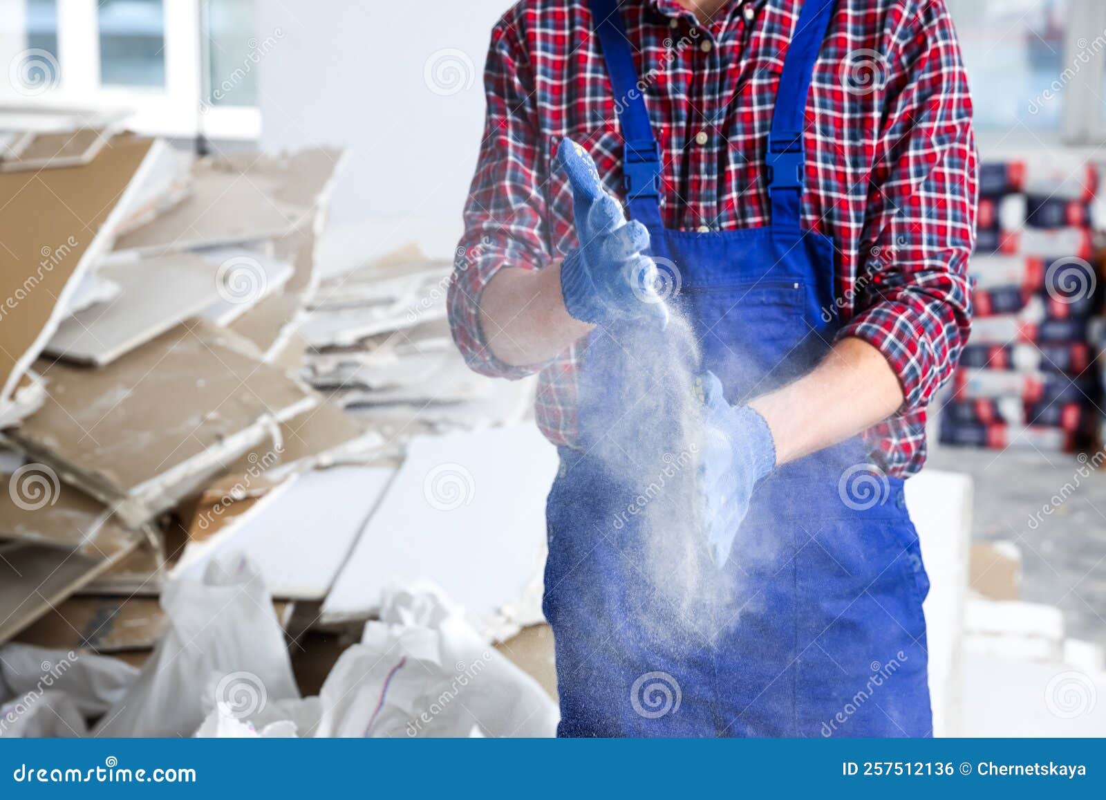 Construction Worker Shaking Off Dust from Hands in Room Prepared for ...