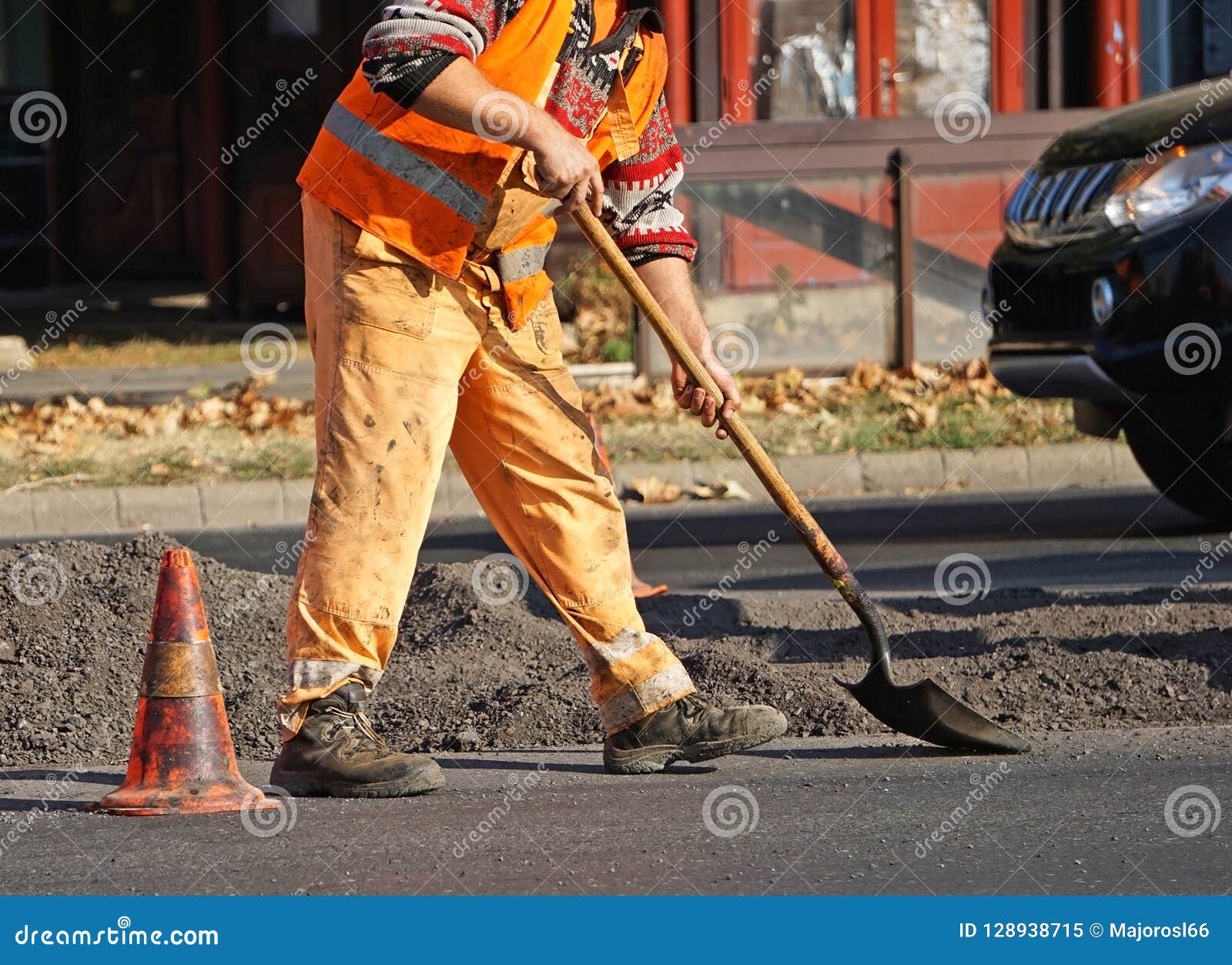 Worker With Shovel Is Digging A Pit On Construction Site. Concept Of ...
