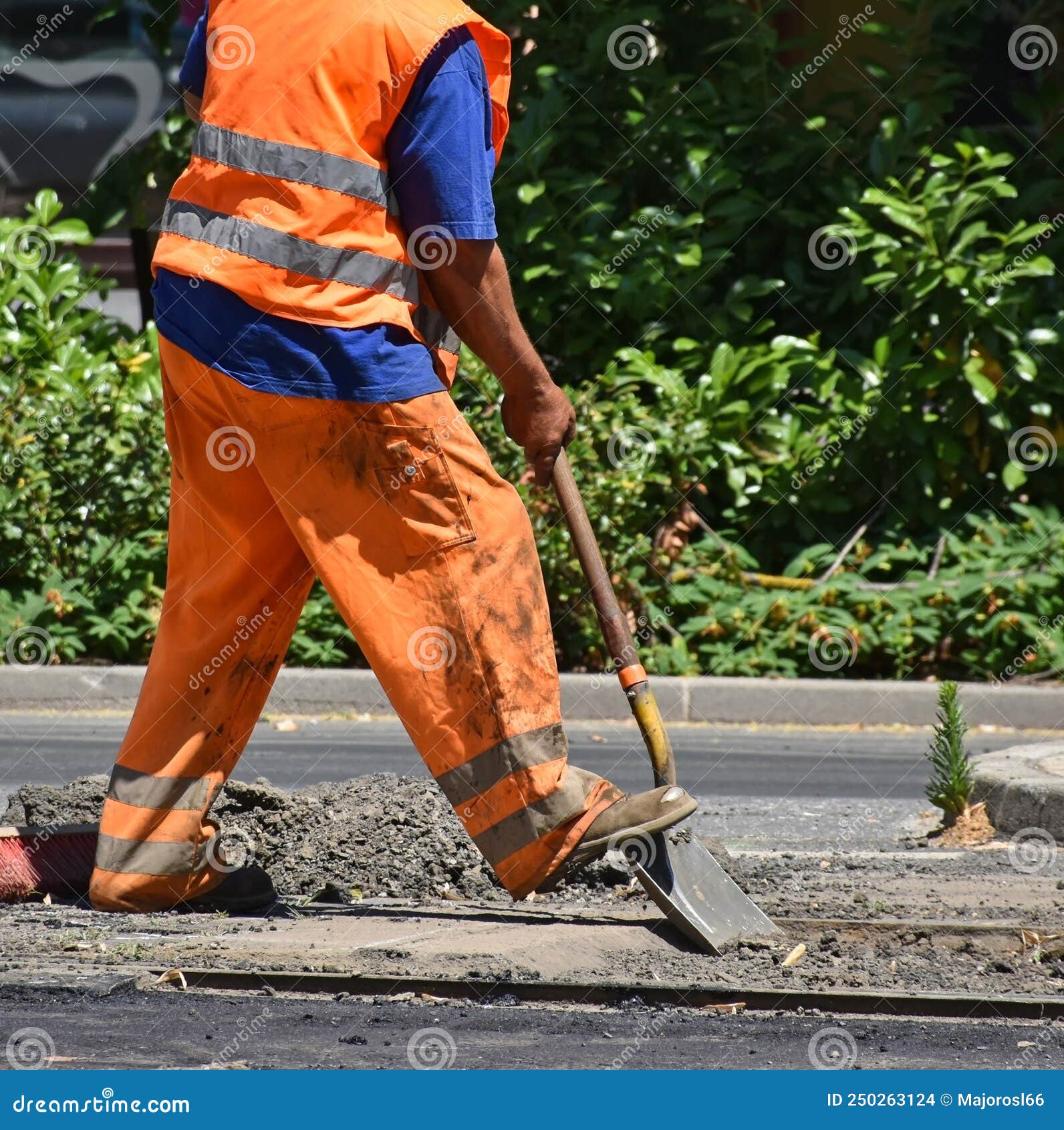 Construction Worker with a Shovel on the Street Stock Photo - Image of ...