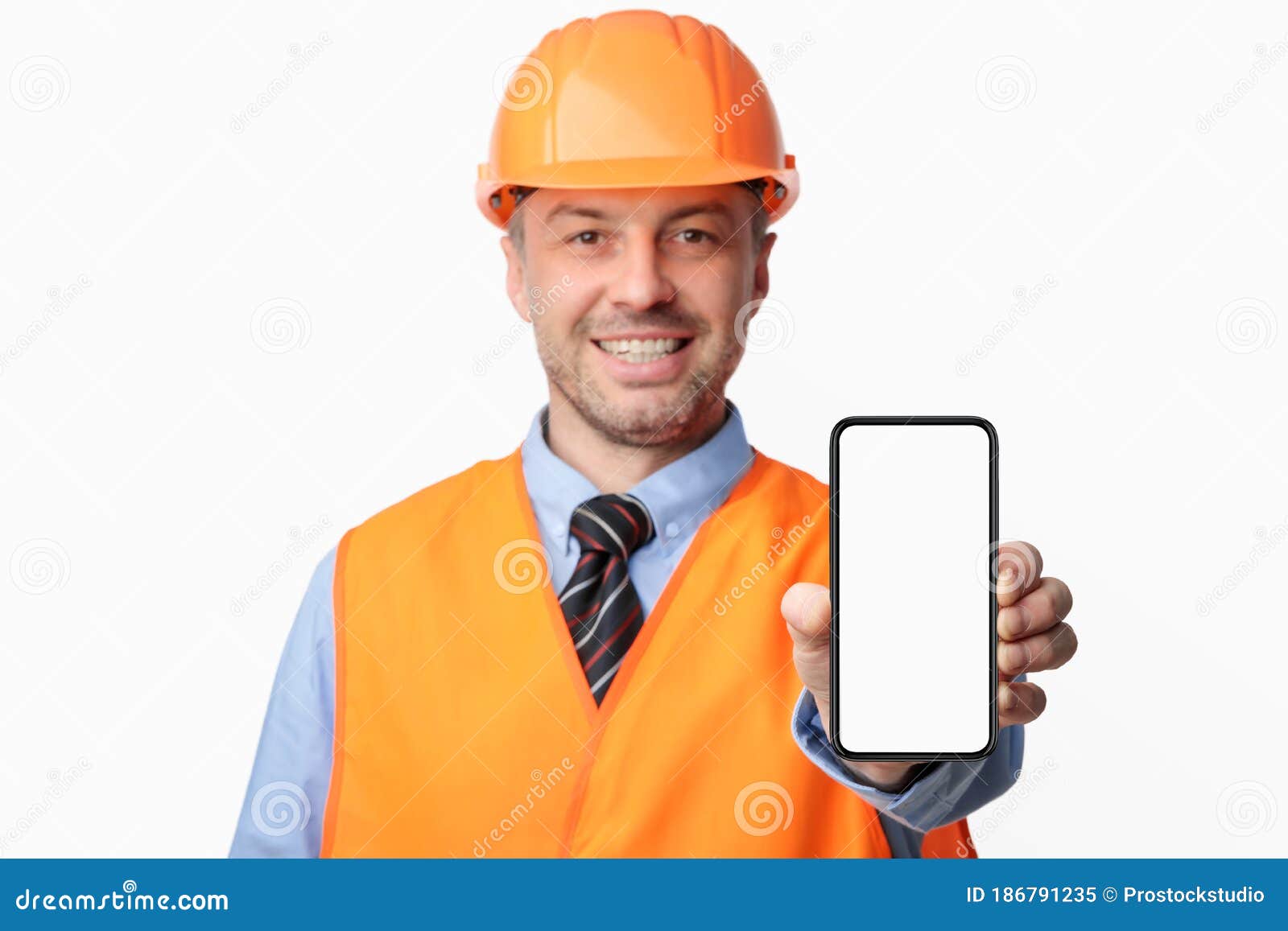 Construction Worker Showing Cellphone Screen on White Studio Background ...