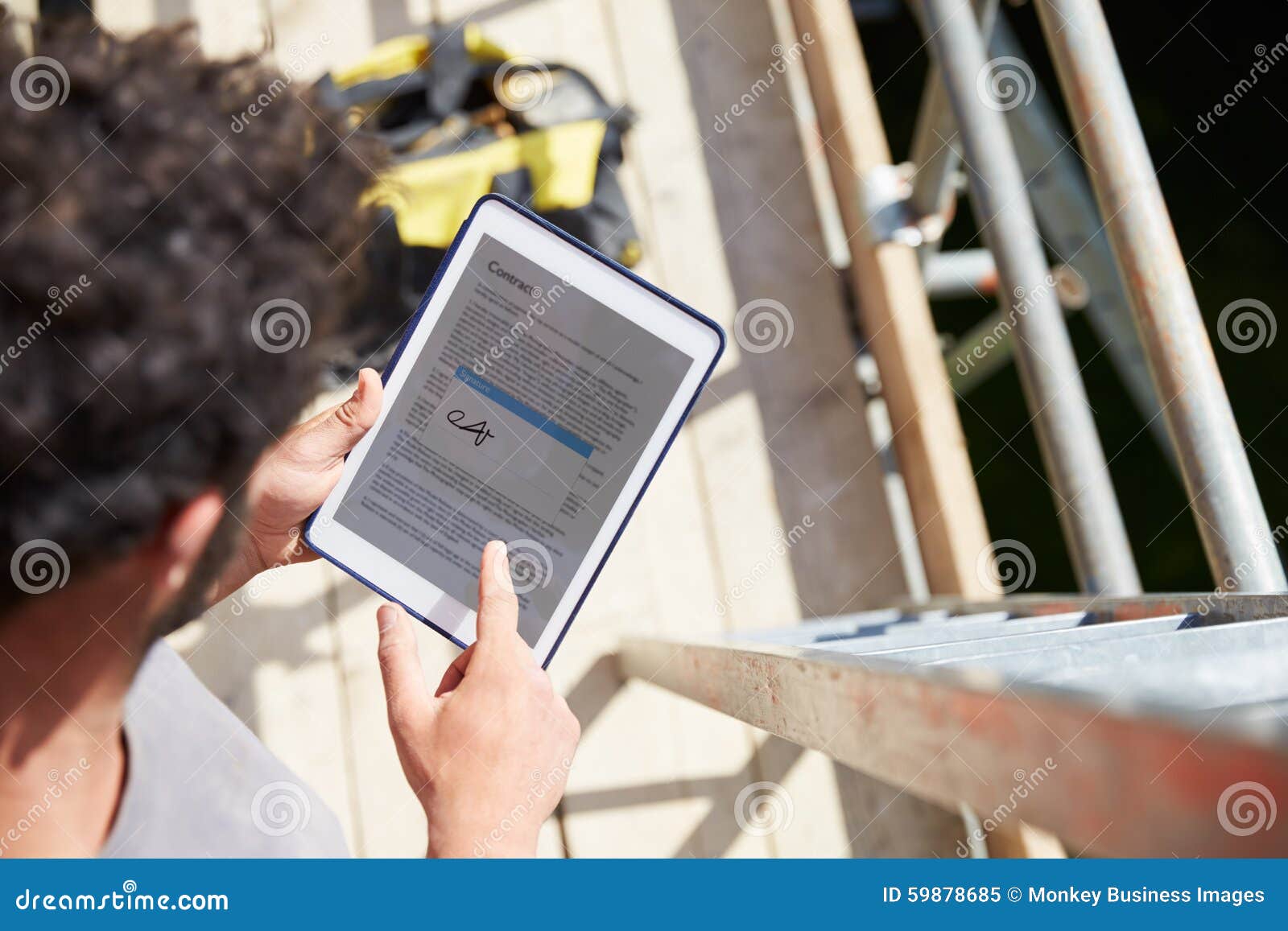 Construction Worker Signing Contract on Digital Tablet Stock Image ...