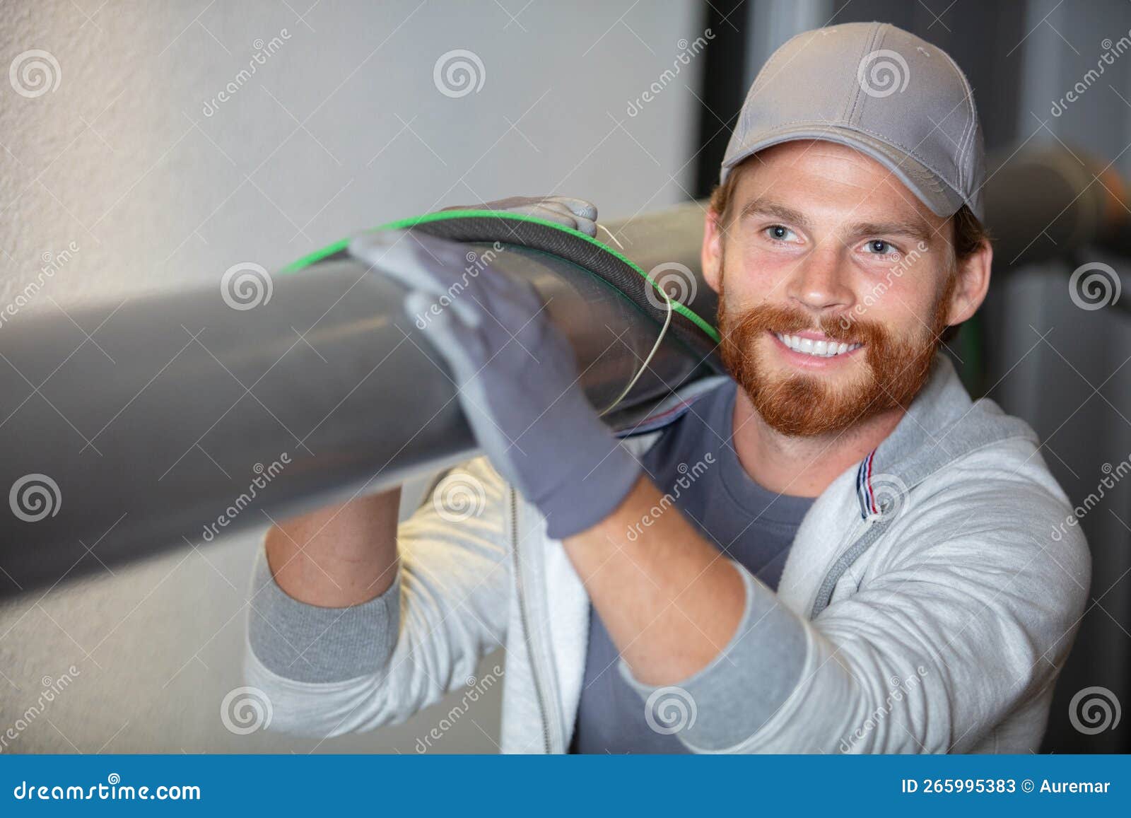 Construction Worker on Site Carrying Pipe on Shoulder Stock Image ...