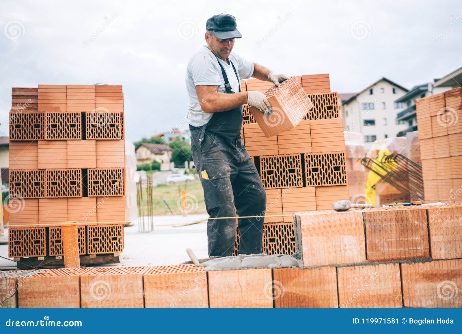 Worker on Construction Site Working with Bricks Stock Image - Image of ...