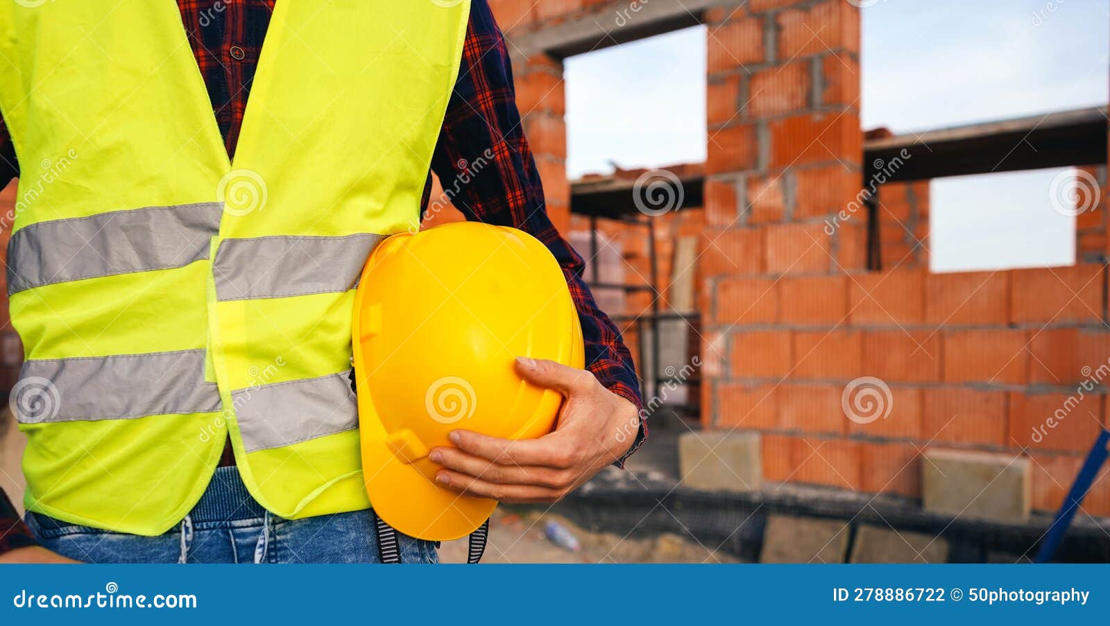 Construction Worker on Site Zone. Worker Holding Hard Hat and Staying ...