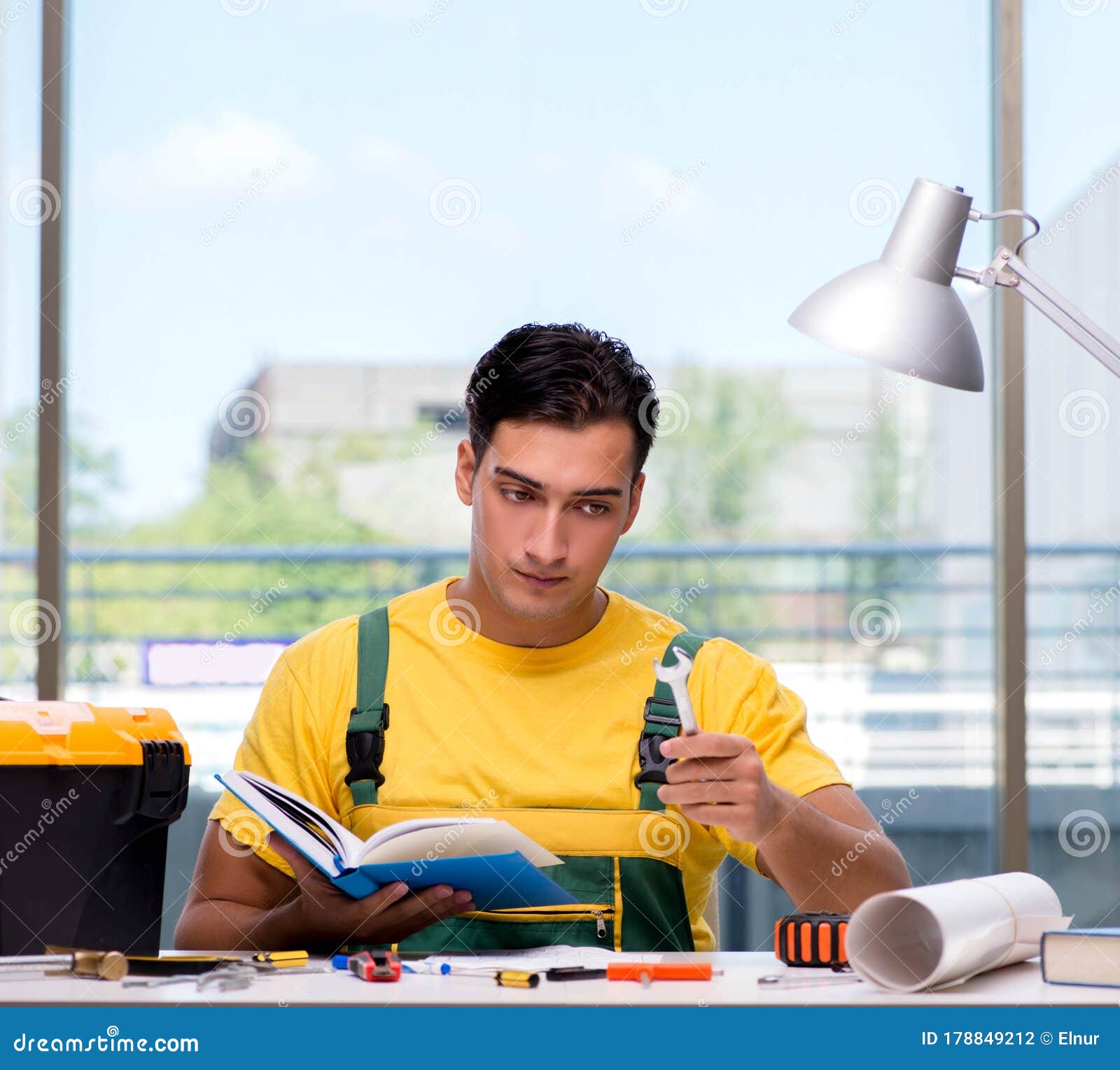 Construction Worker Sitting at the Desk Stock Photo - Image of career ...